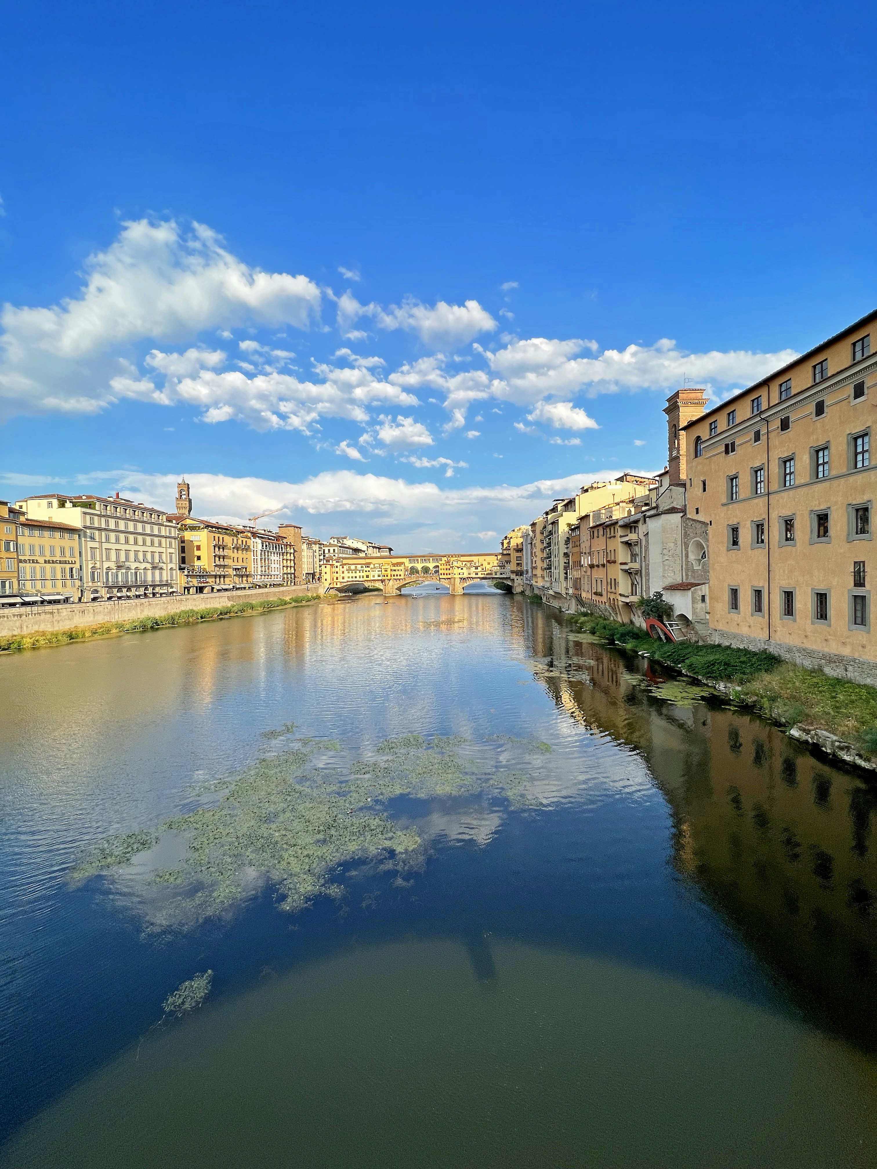 A river running through a city next to tall buildings photo – Free ...