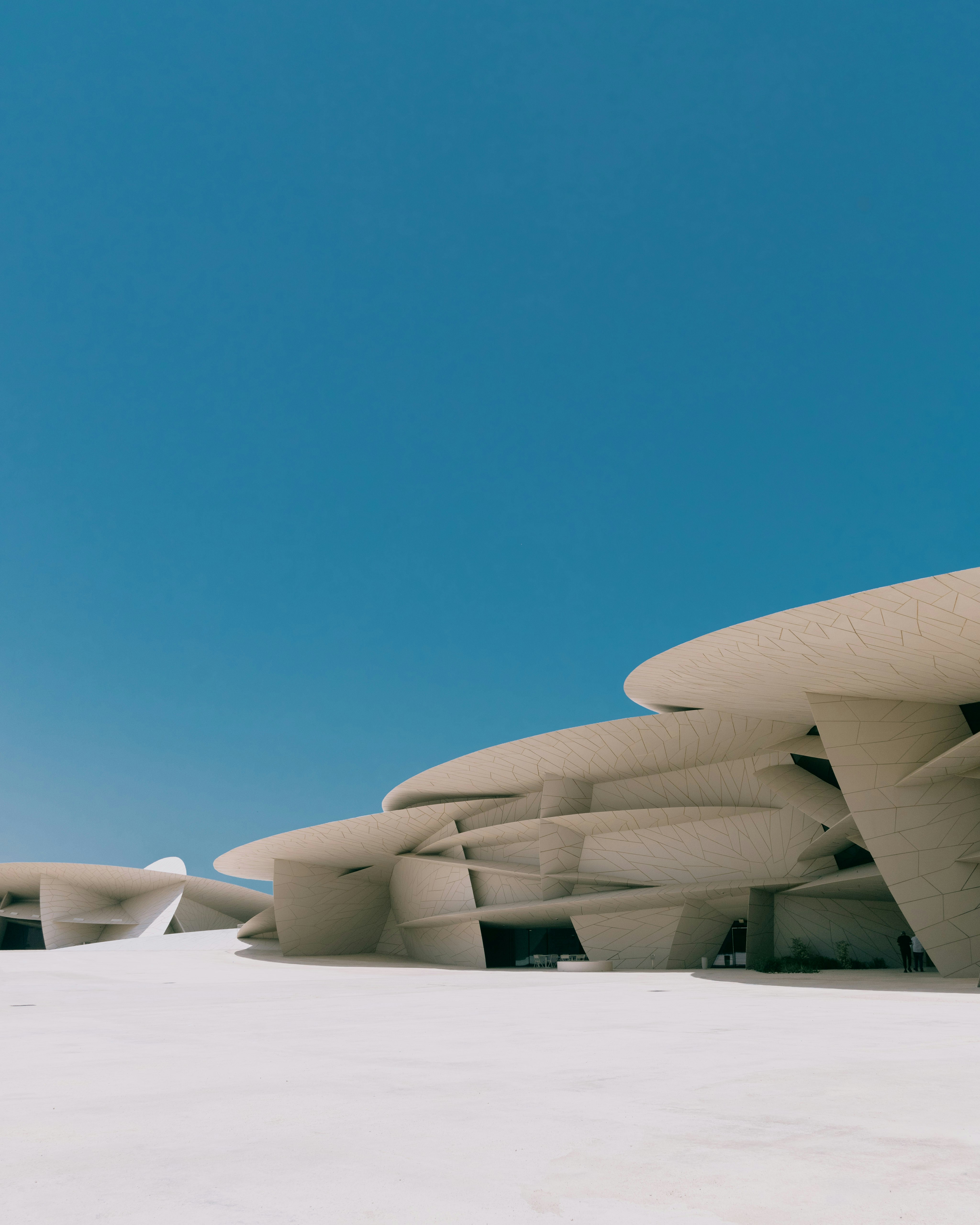 Deserted White Canopy: Geometric Architecture under an Expansive Sky