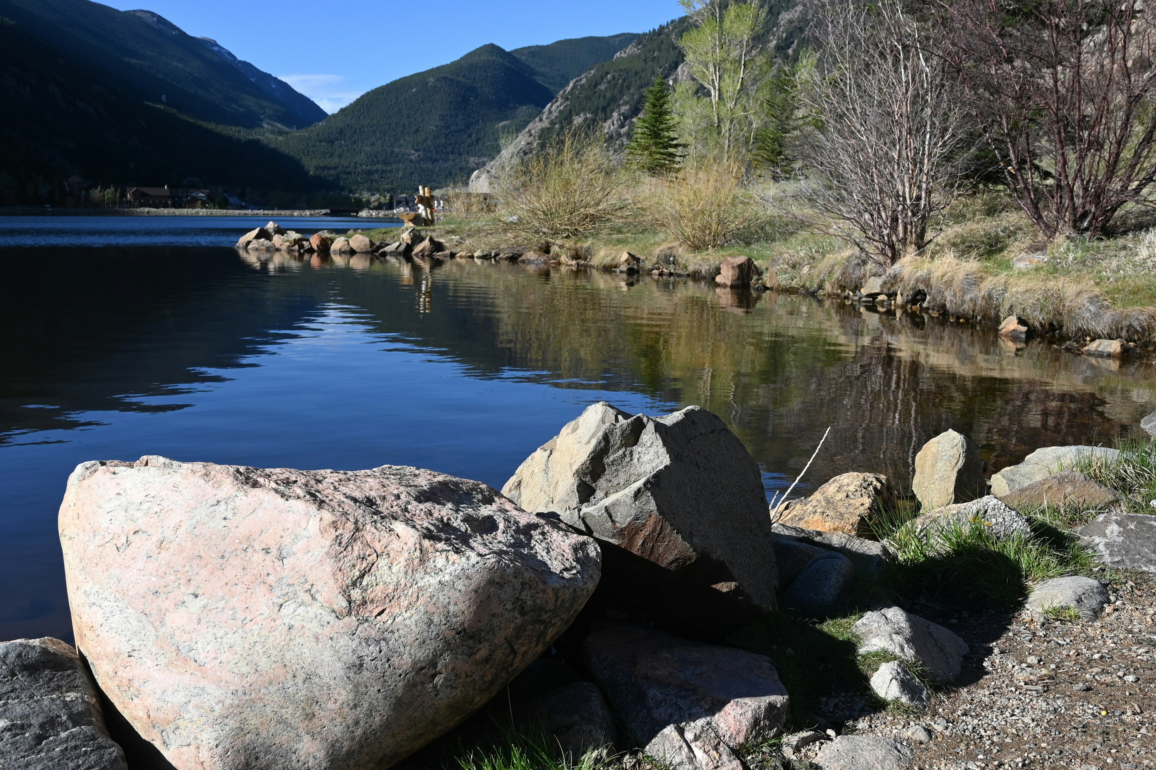 A large rock sitting next to a body of water photo – Free Georgetown ...
