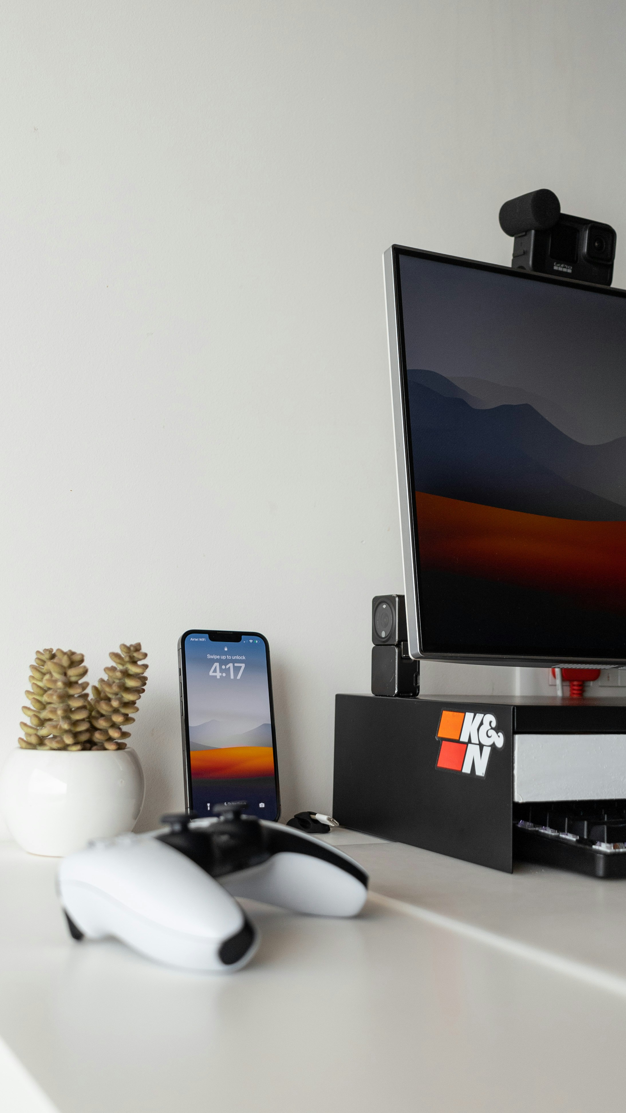 A white desk with a phone and a computer monitor photo – Free Monitor ...