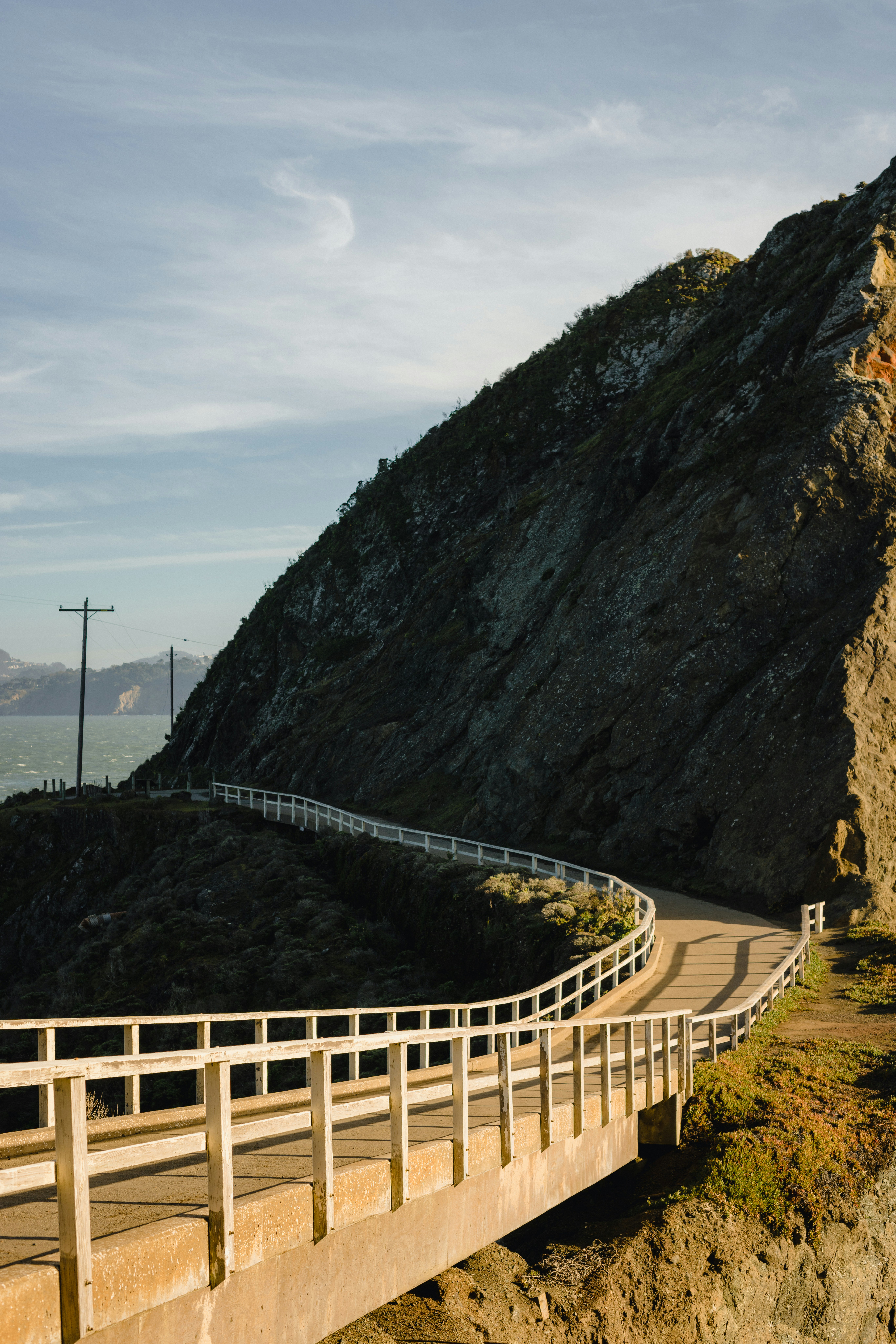 Sunlit Switchback: Coastal Path Winding Along the Cliffside