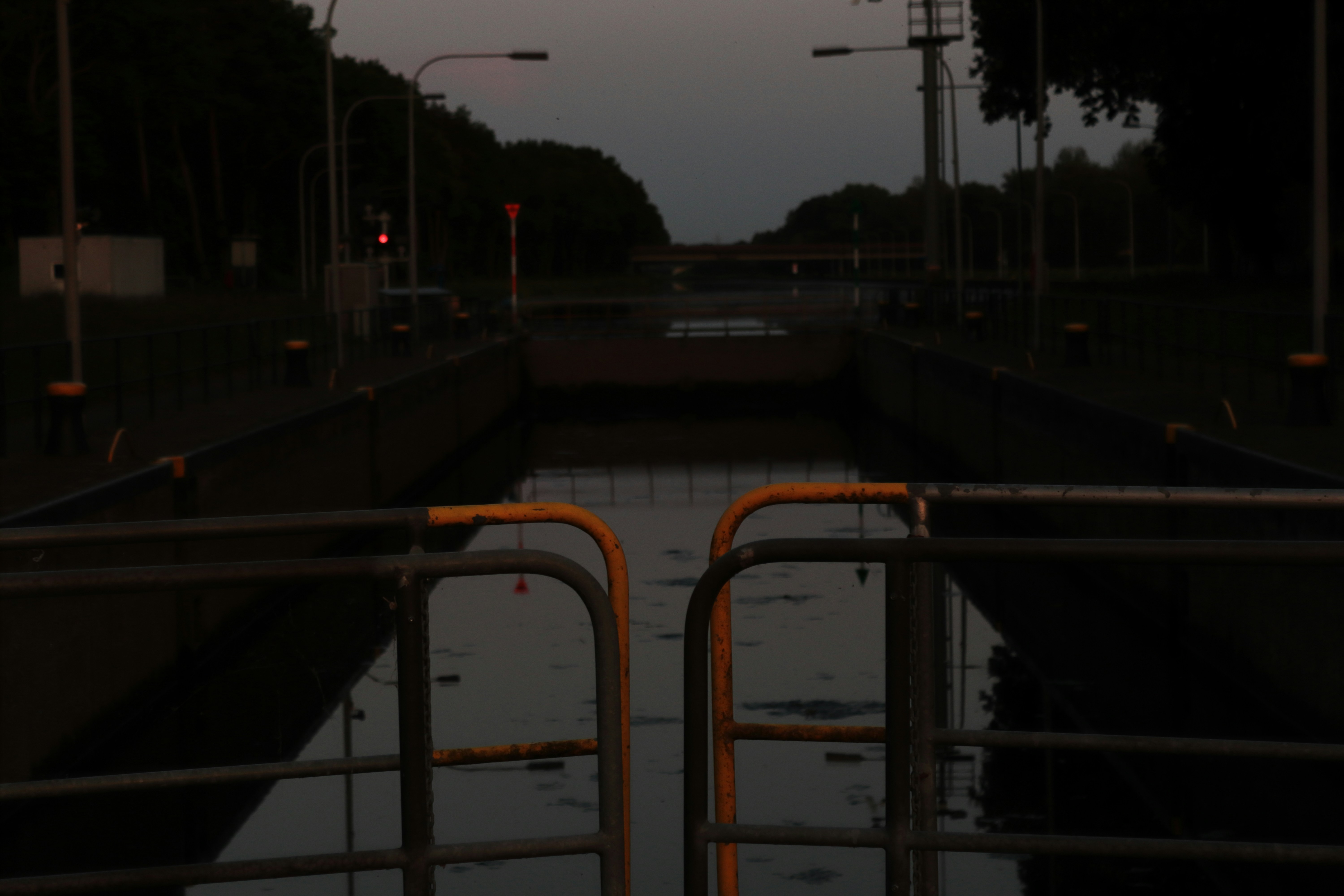 Dusk at the Lock: Rails Framing a Quiet Canal