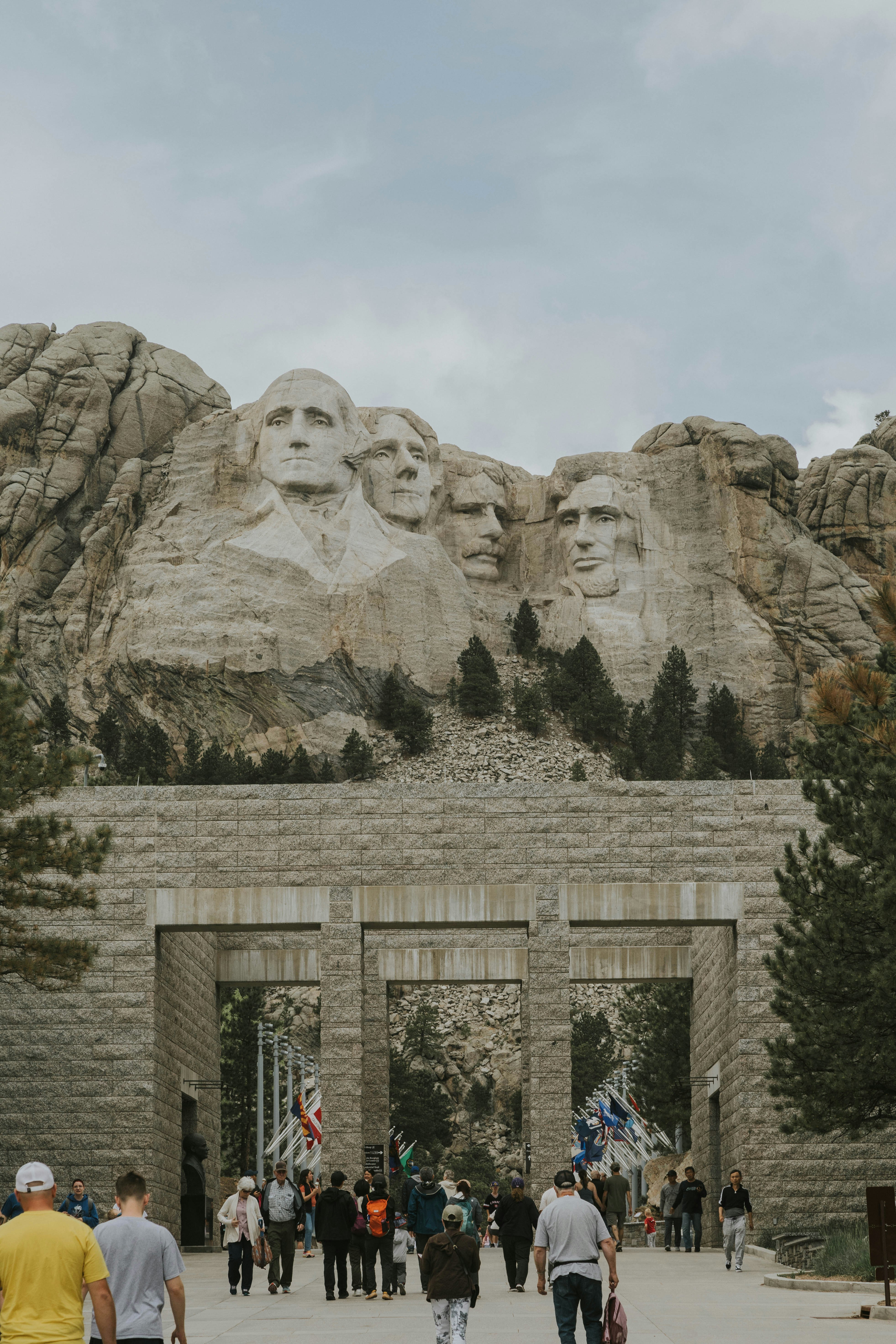 A group of people walking in front of a mountain photo – Free Mount ...