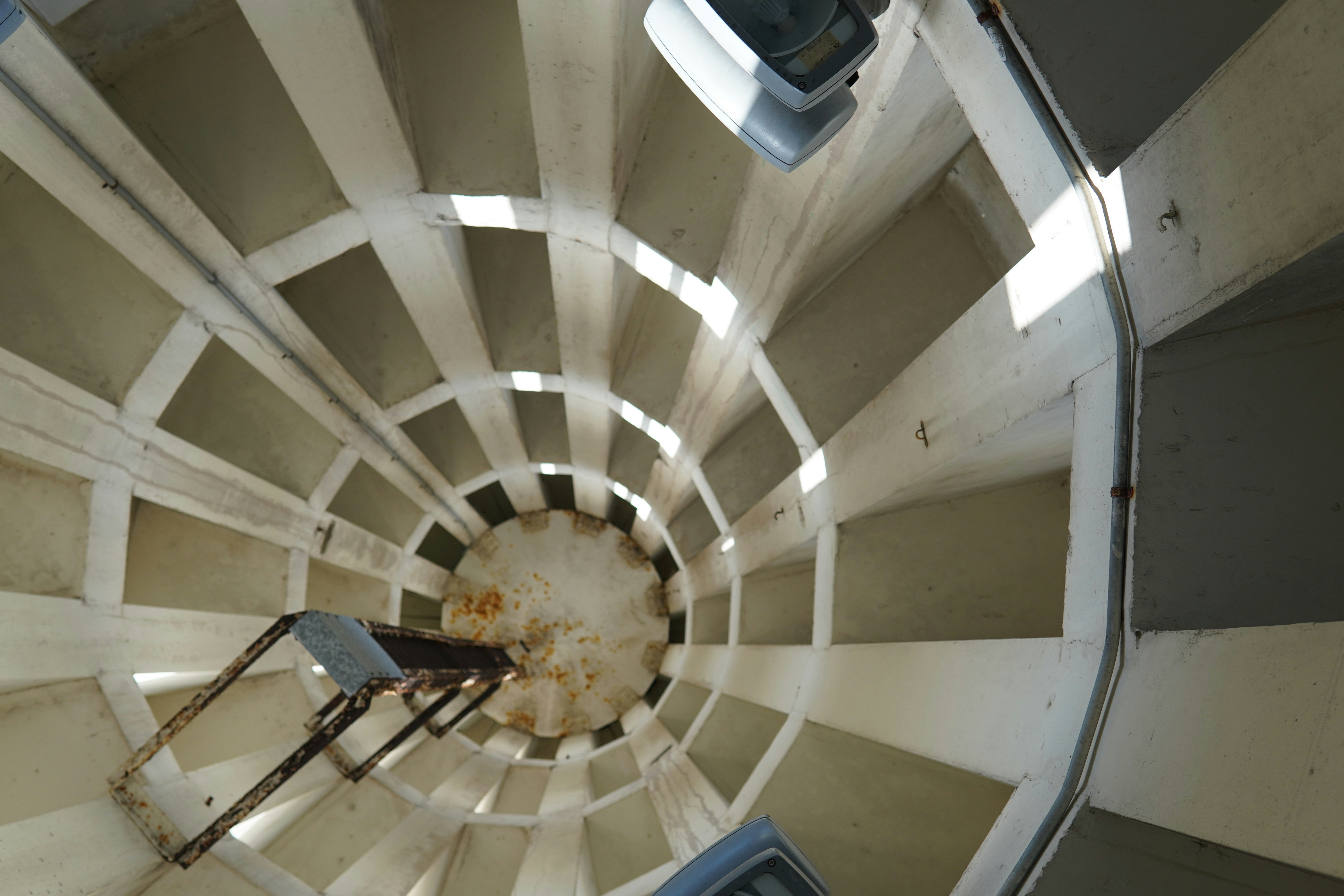 A view from the top of a tower looking down at a clock photo – Free ...