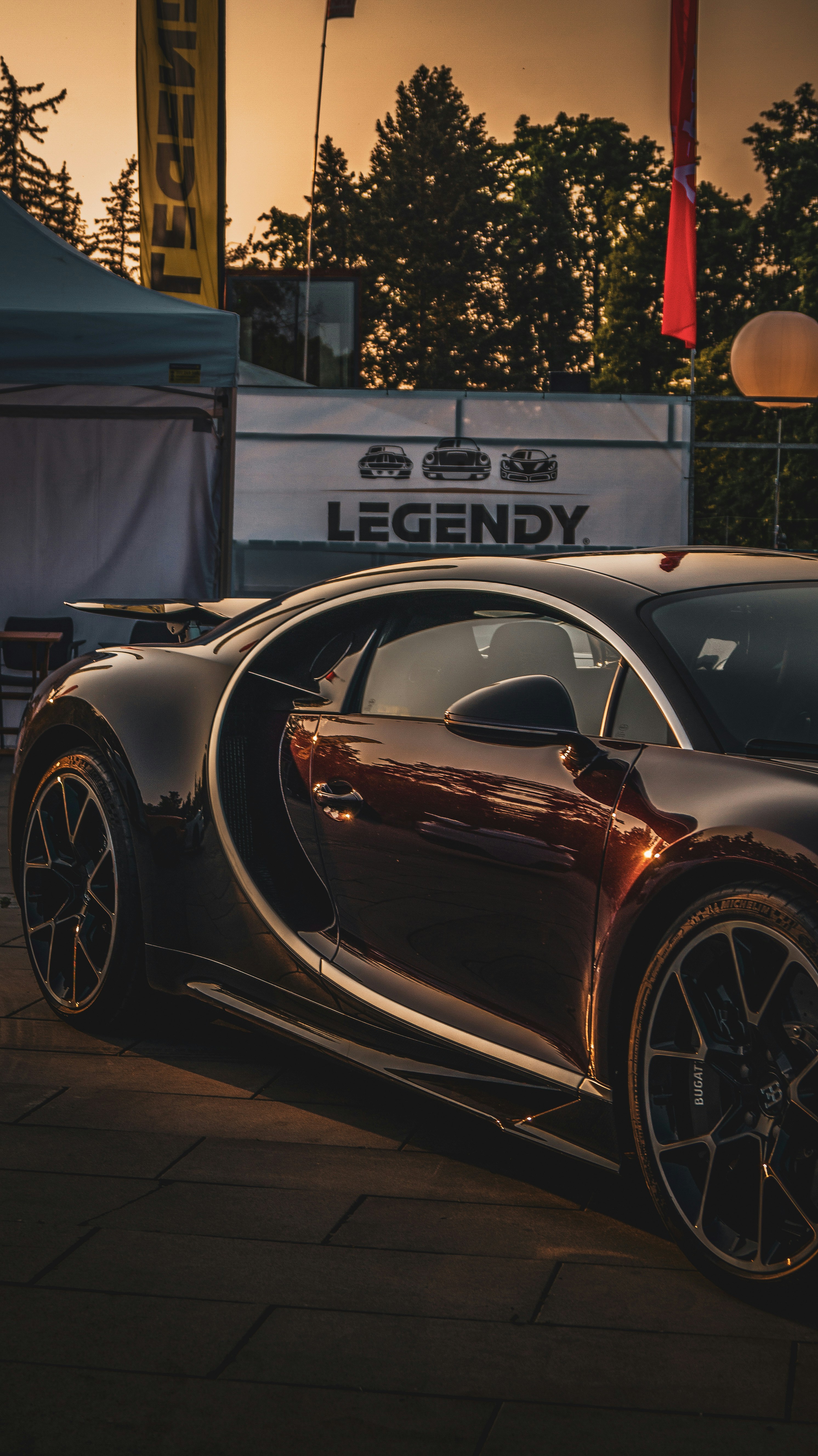 A bugatti is parked on the side of the road photo – Free Machine Image ...
