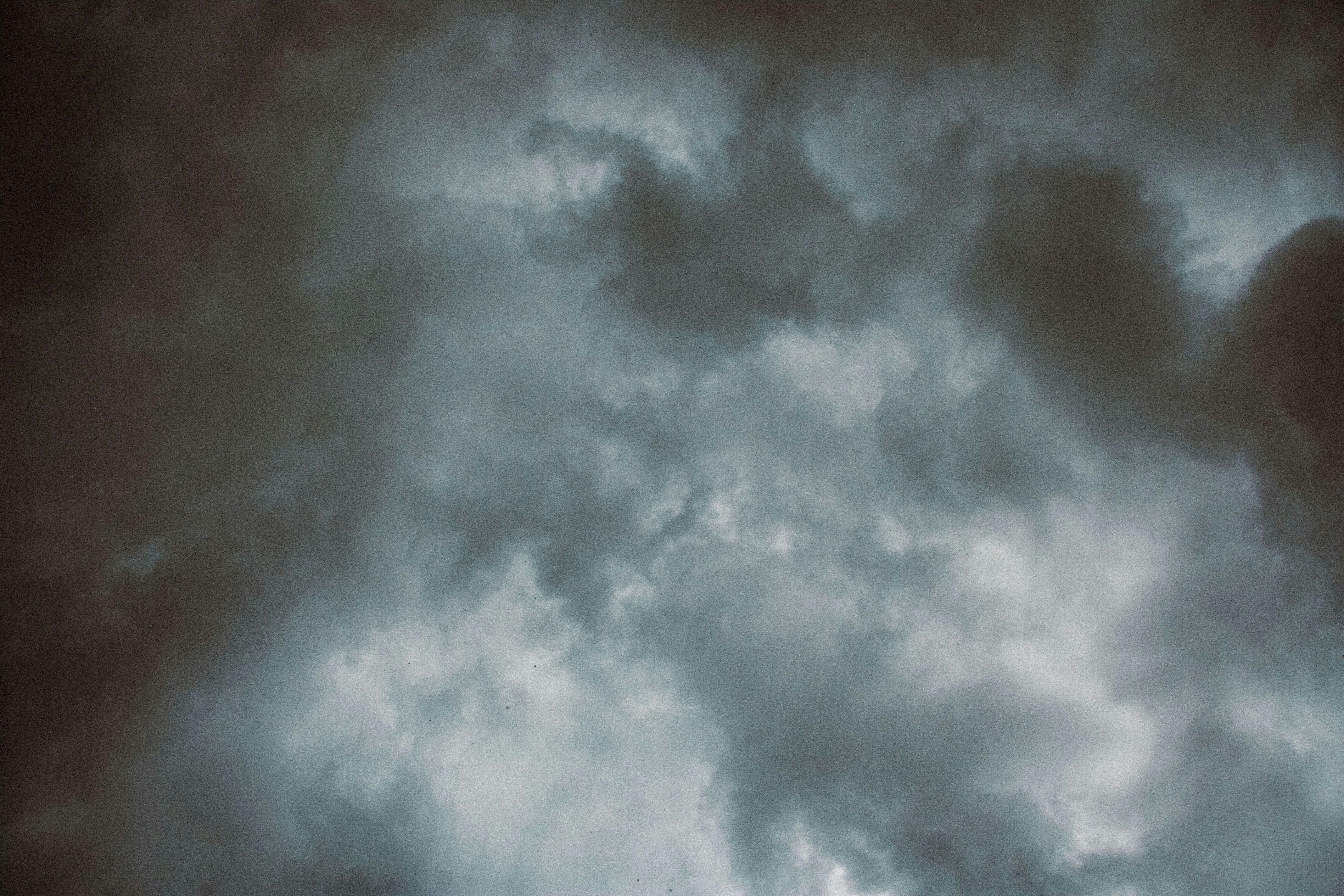 Dark, swirling clouds forming an ominous pattern in the sky.