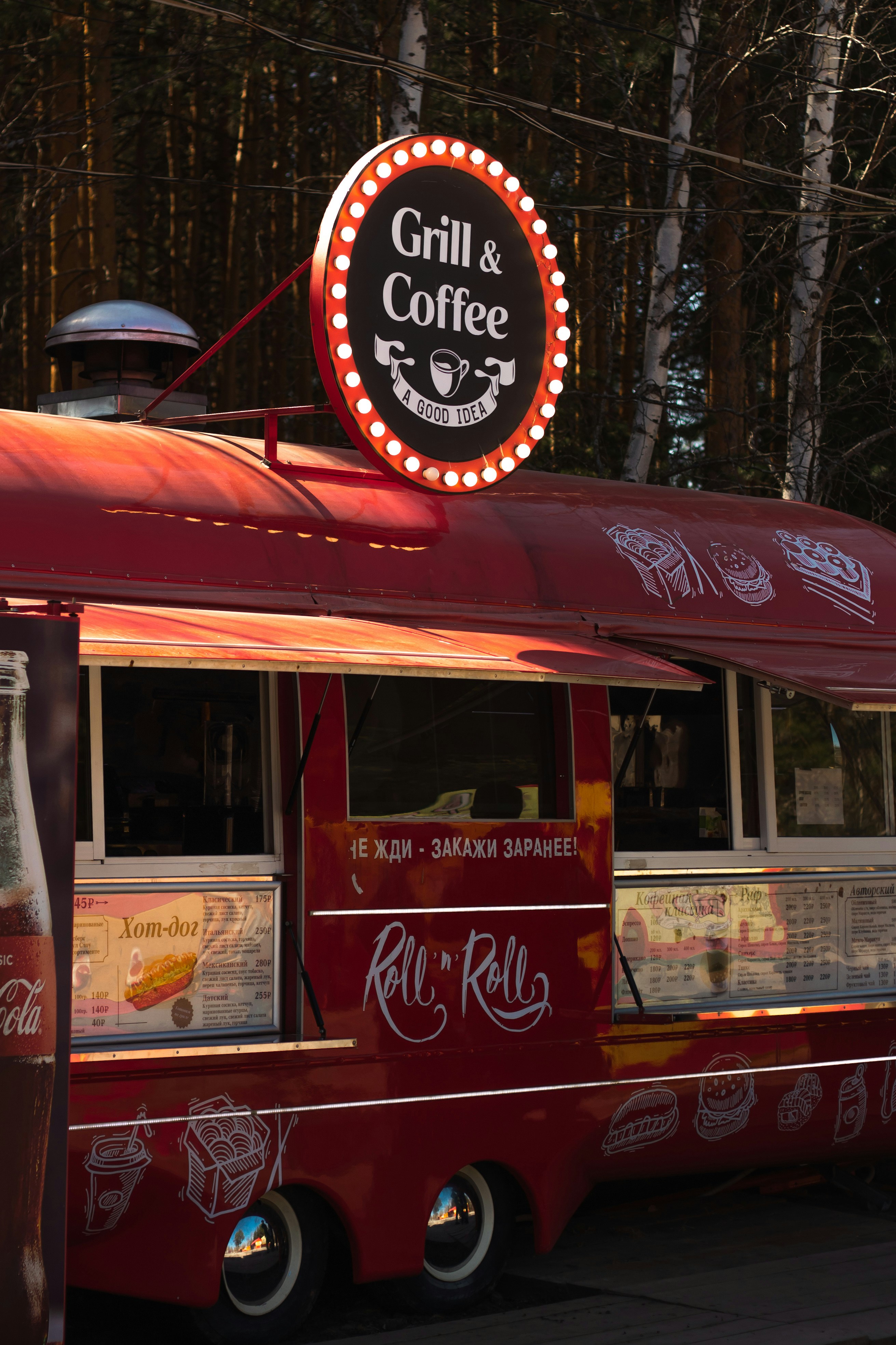 Grill & Coffee Truck under a Bright Circular Sign
