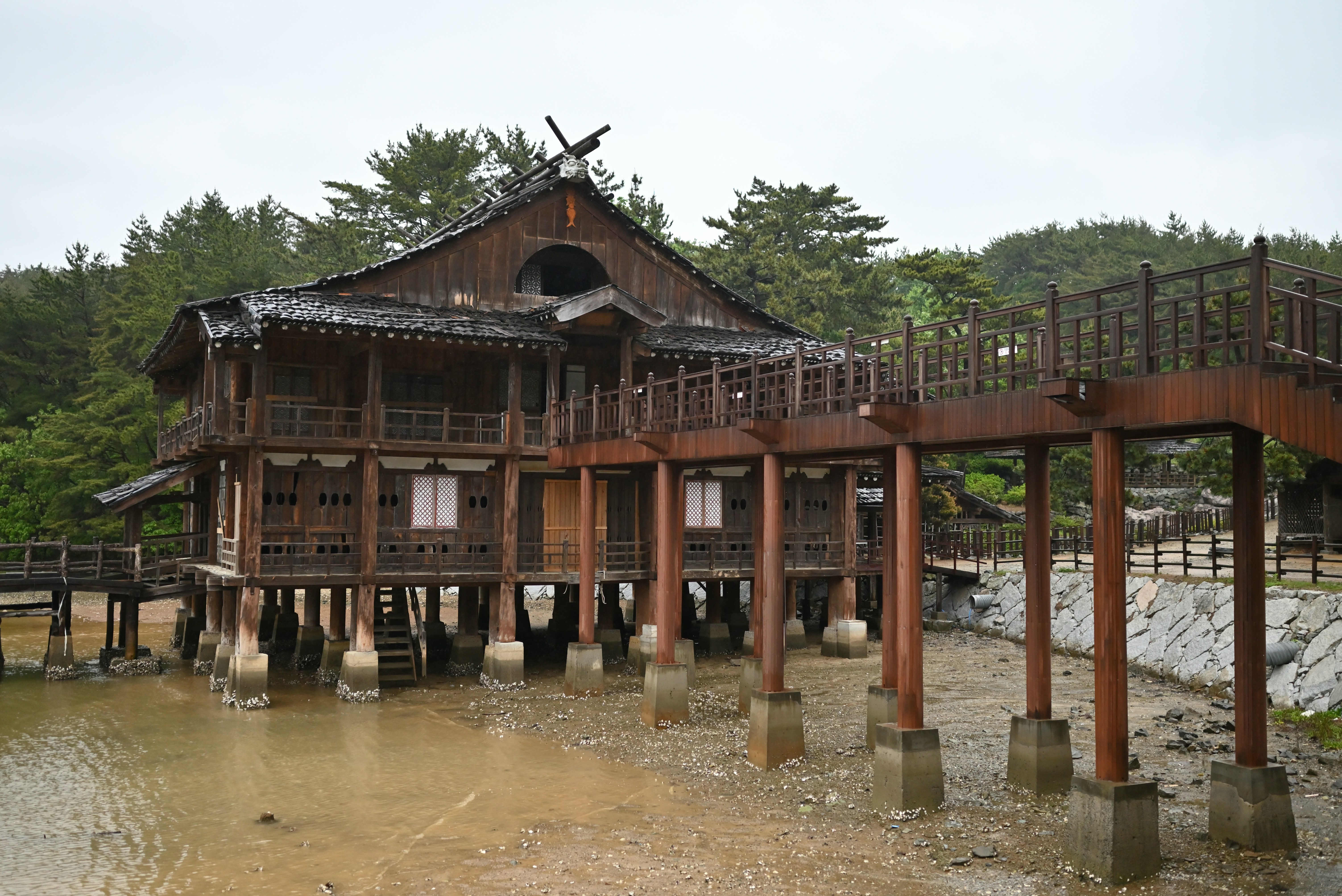 Stilted Timber House Over Mudflats: A Quiet Waterfront Relic