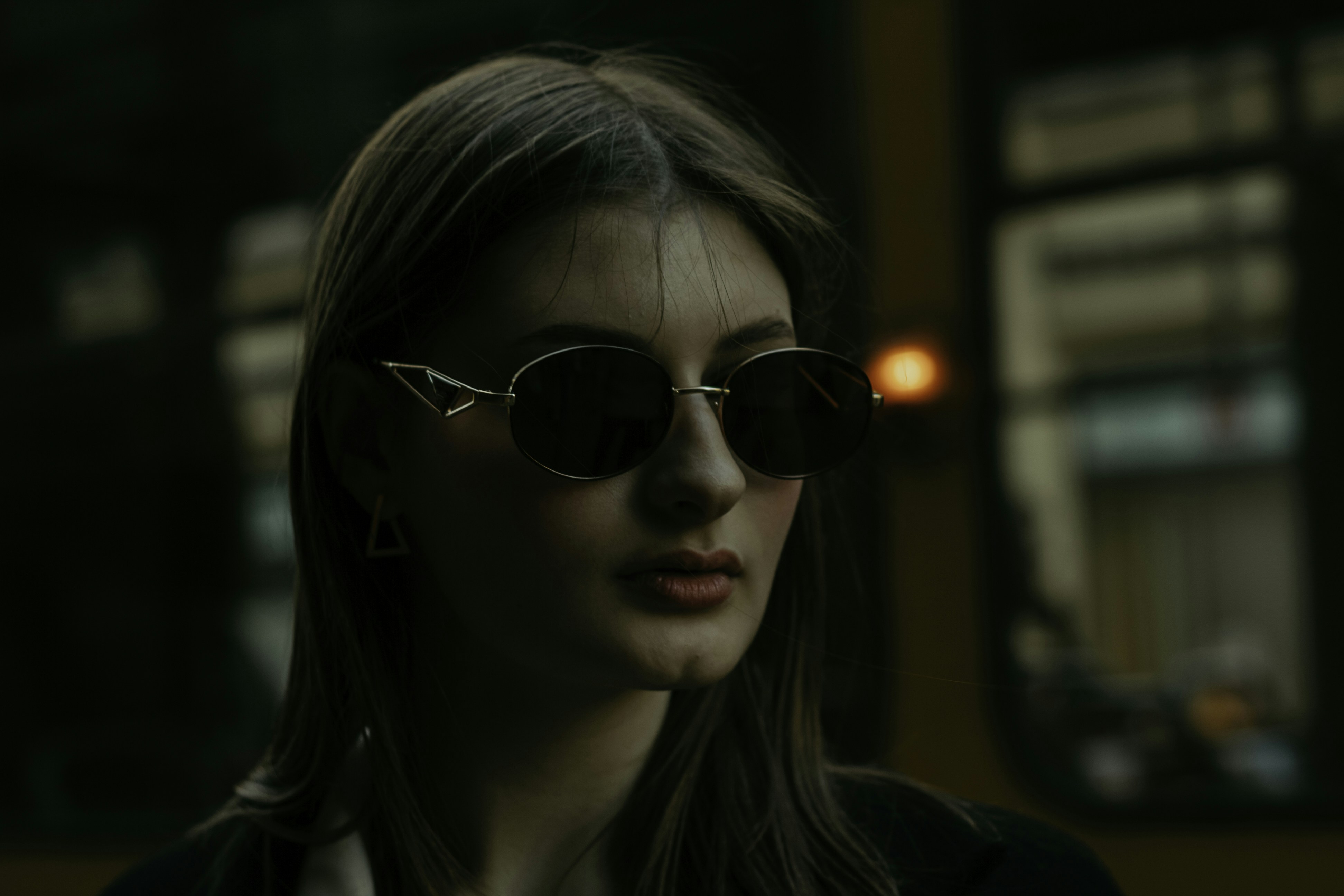 Shadowed Gaze: A Quiet Portrait in Neon-Soft Light