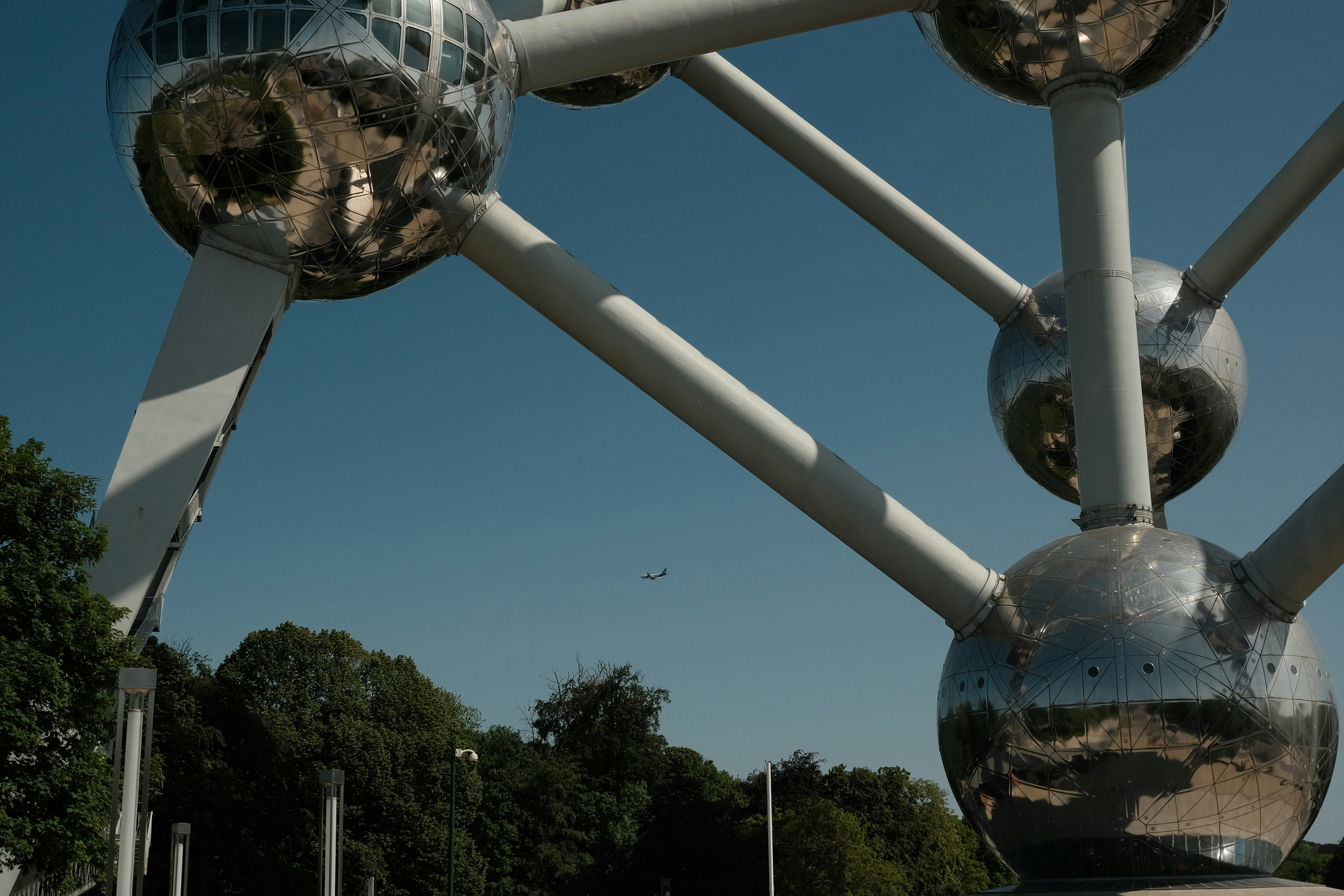 Brussels' Orbital Beacons: Sunlit Spheres Linked in Steel