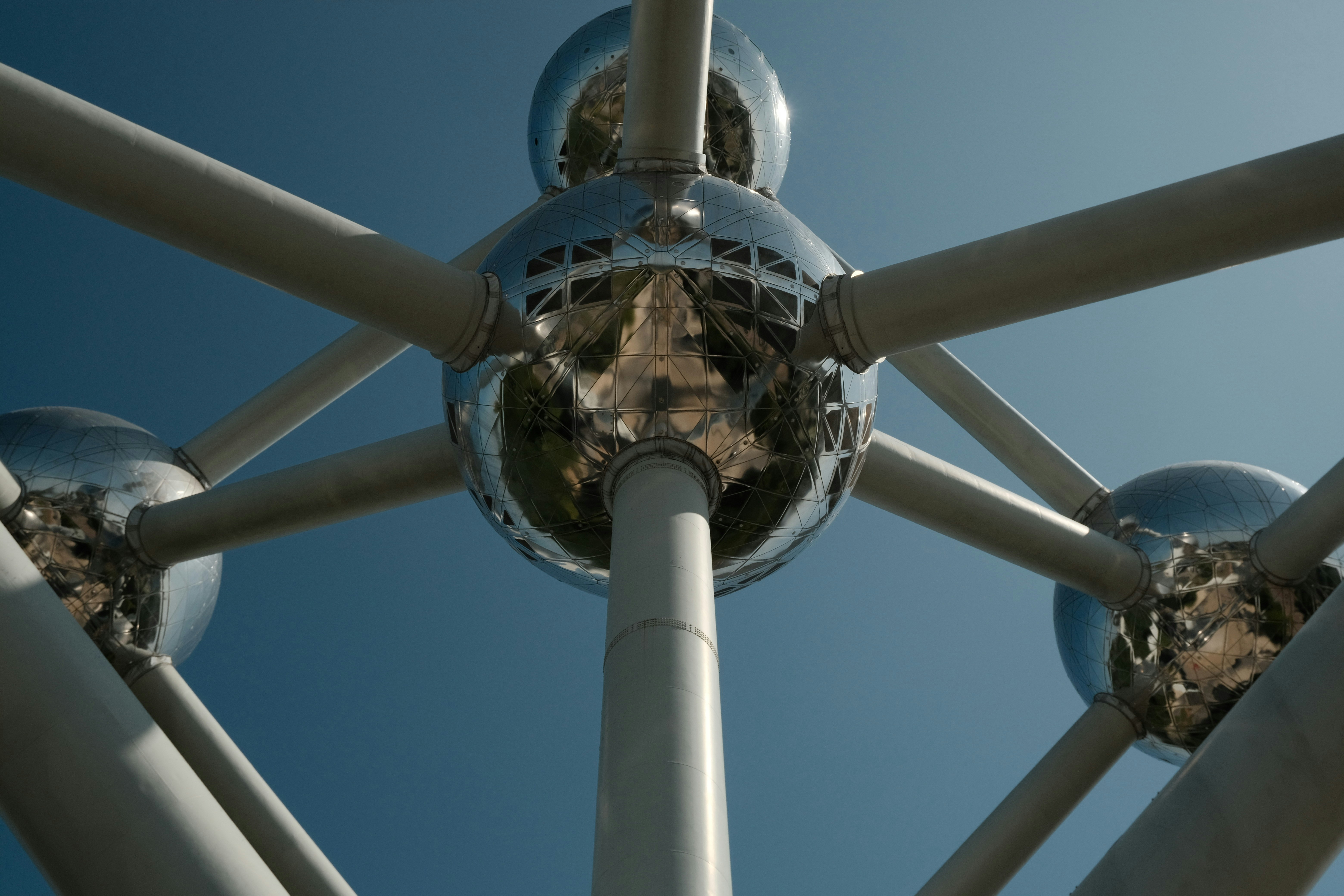 A large metal structure with mirrored balls on it photo – Free Airplane ...