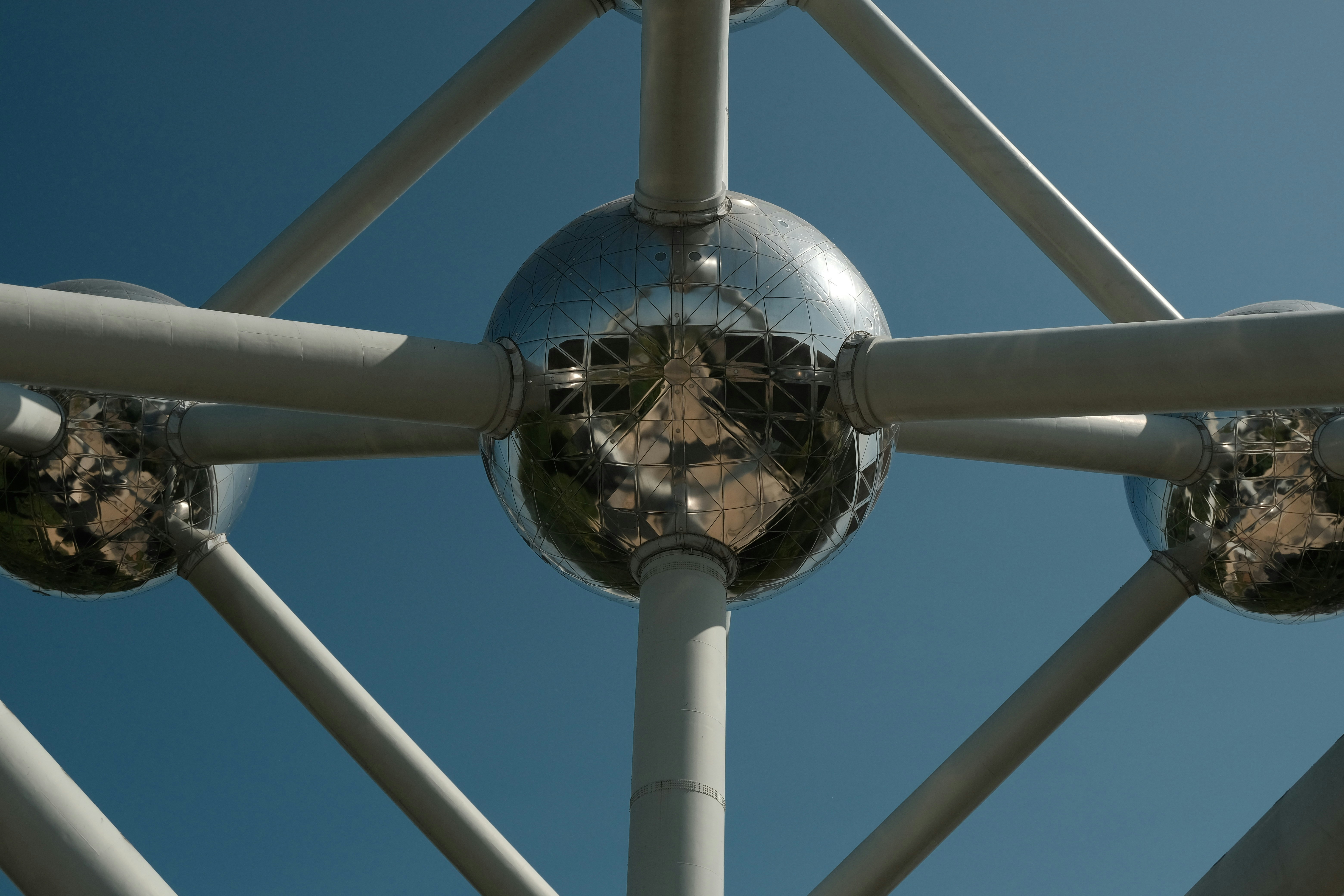 A metal structure with a mirror ball on top of it photo – Free Sphere ...
