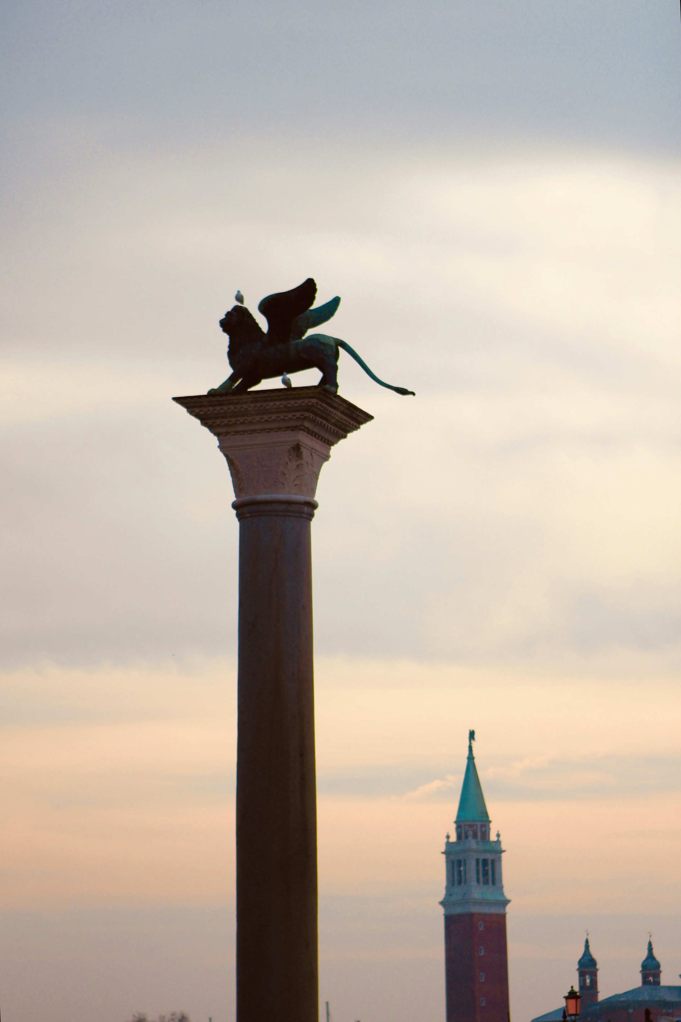 Dusk over the Column: Winged-Lion with a Campanile Silhouette