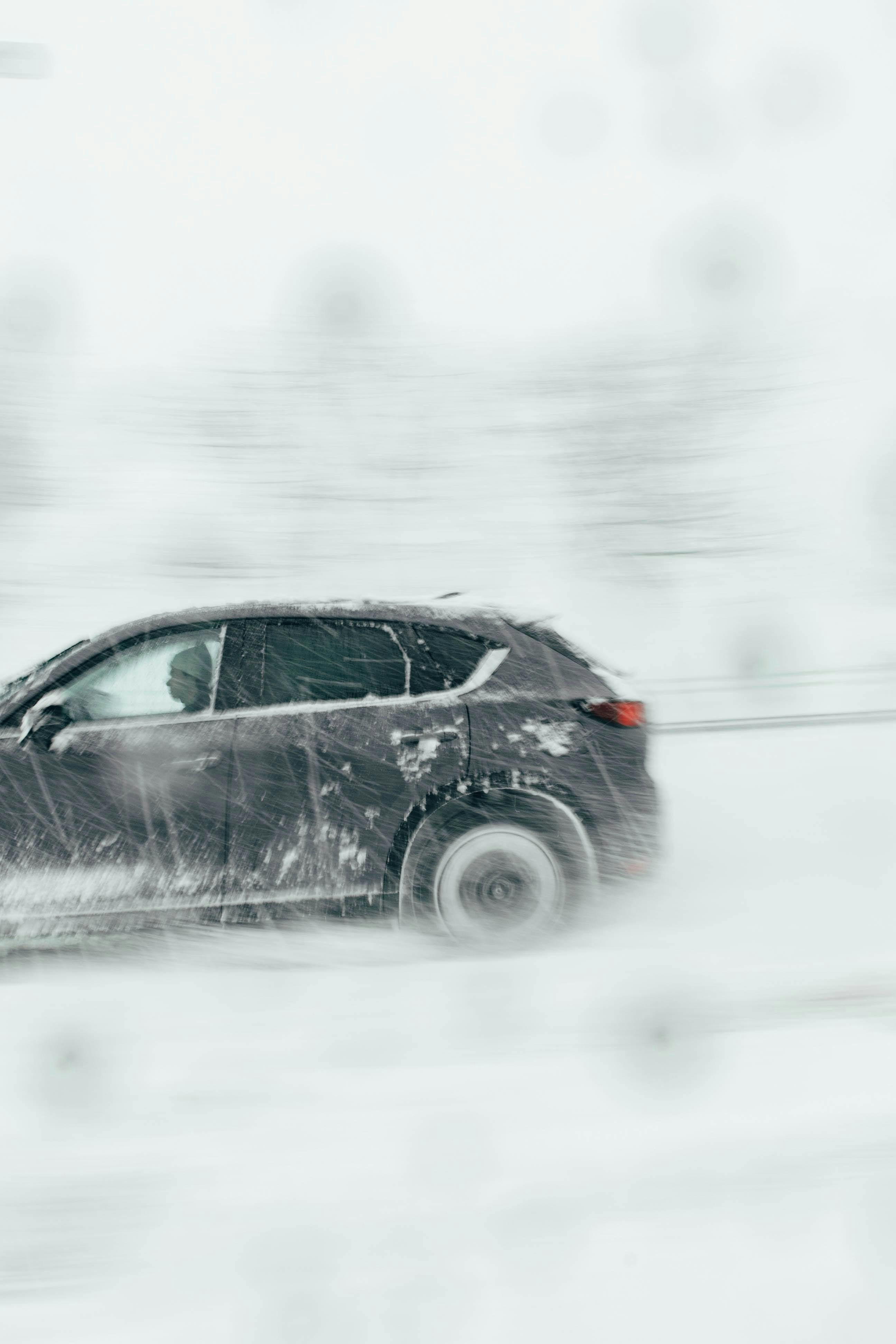 A car driving down a snow covered road photo – Free Purdue university ...