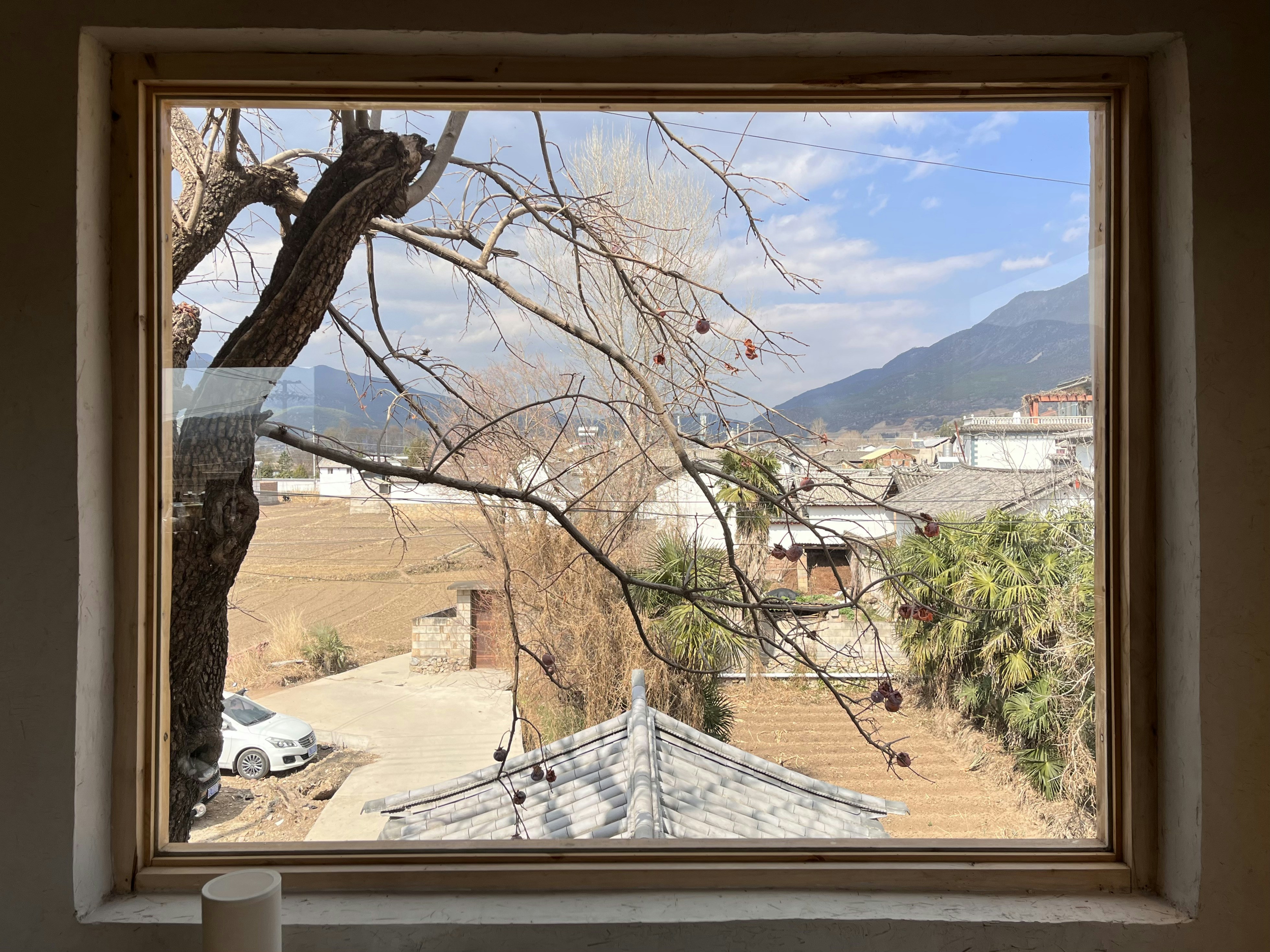 A window with a view of the mountains outside photo – Free Autumn Image ...