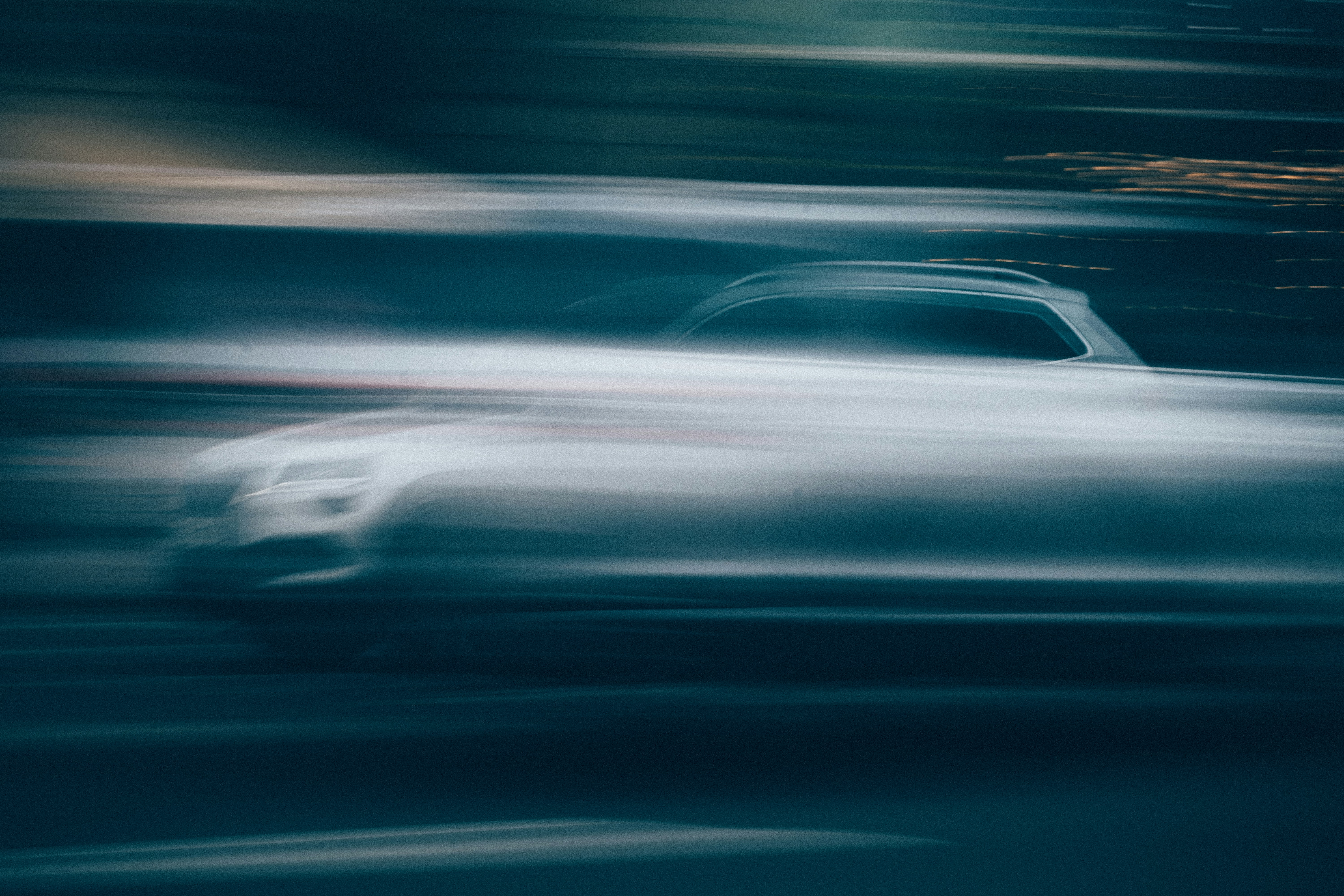 A blurry photo of a car driving down a street photo – Free Vehicle ...