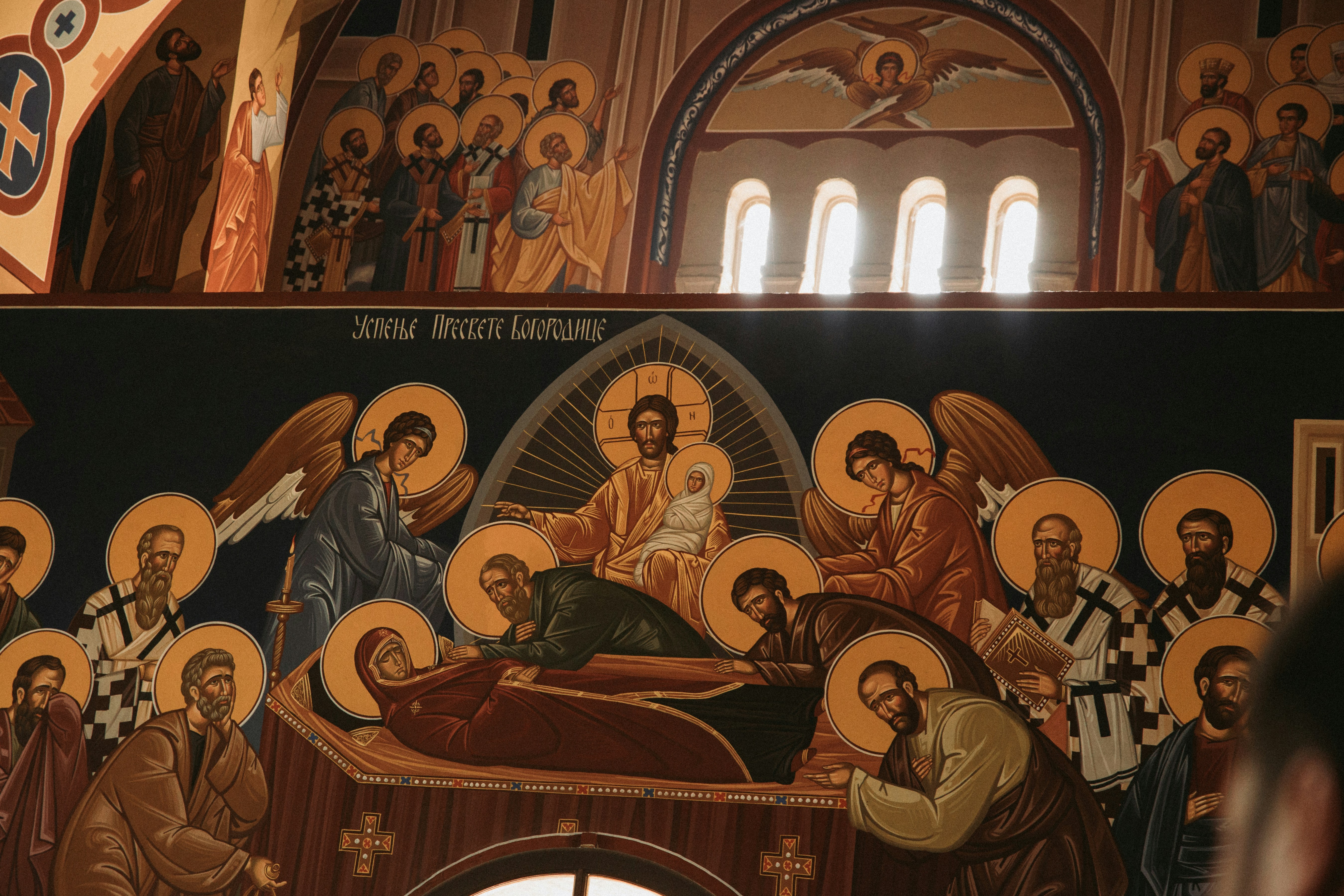 Central Entombment Amid Haloed Figures in a Byzantine Church Mural