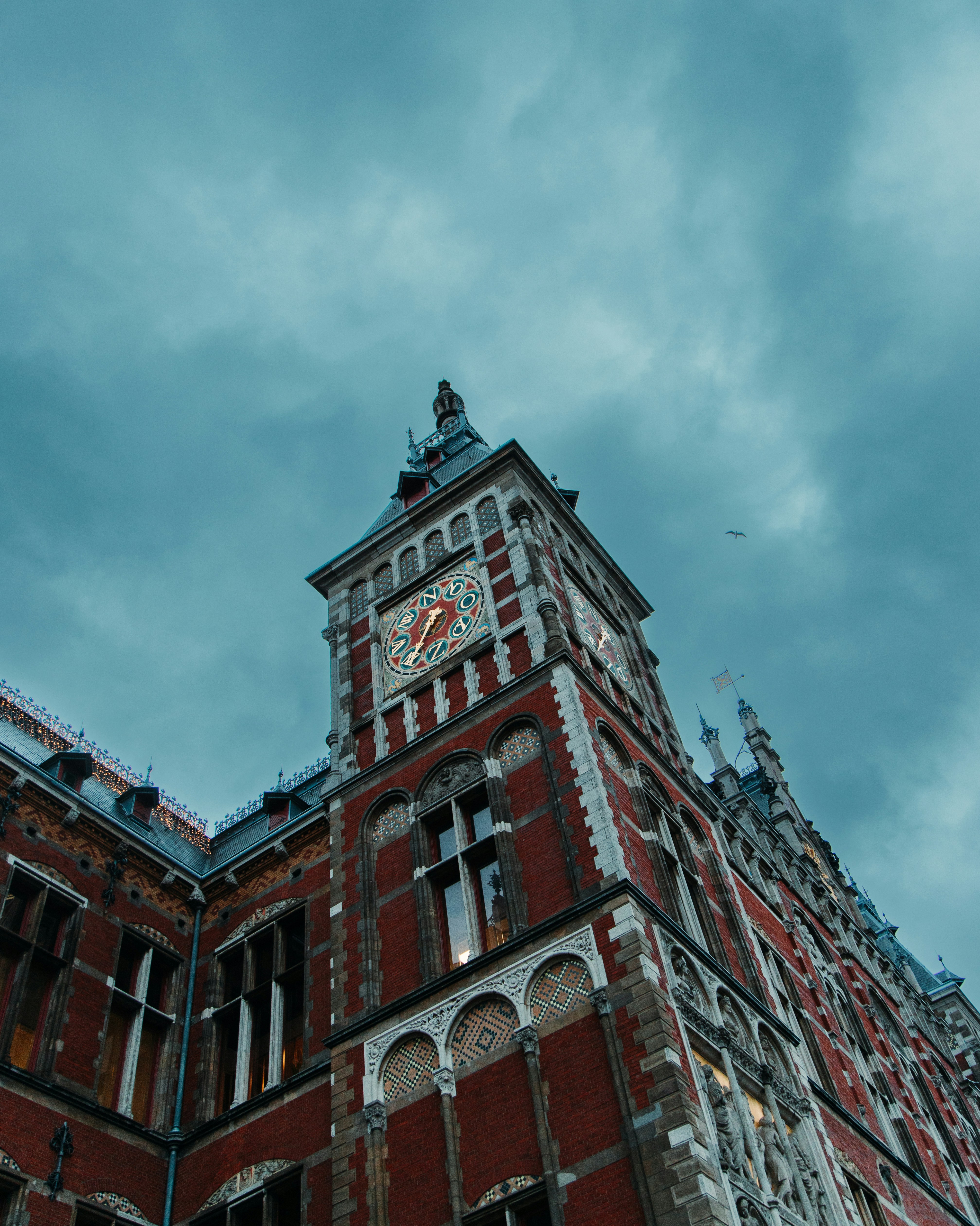 Timekeeper on Brick: Clock Tower Framed Against a Cerulean Sky