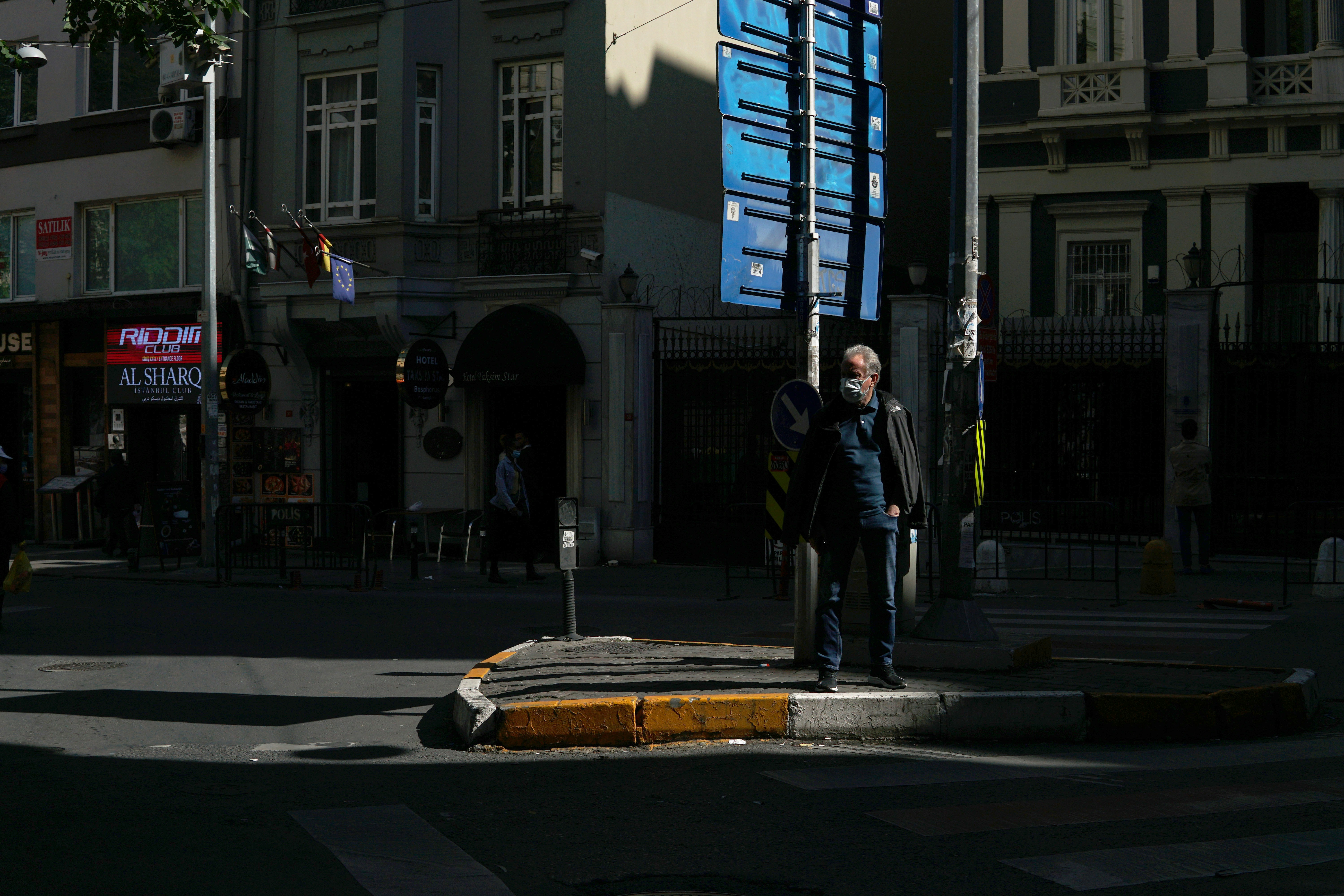 Curbside Portrait under a cobalt city sign
