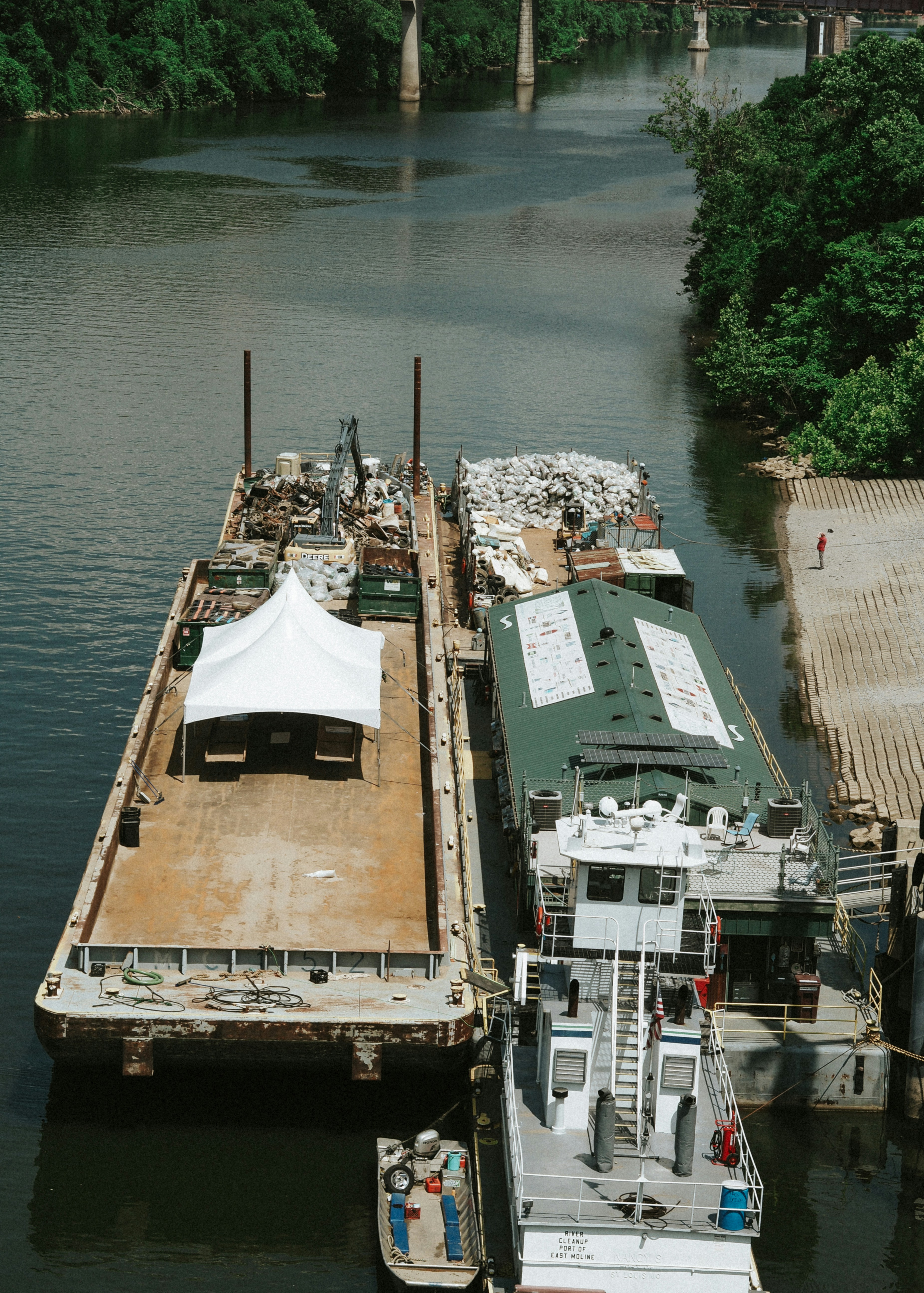 Harbor of Crates and Canopy: Aerial View of Dual Barges