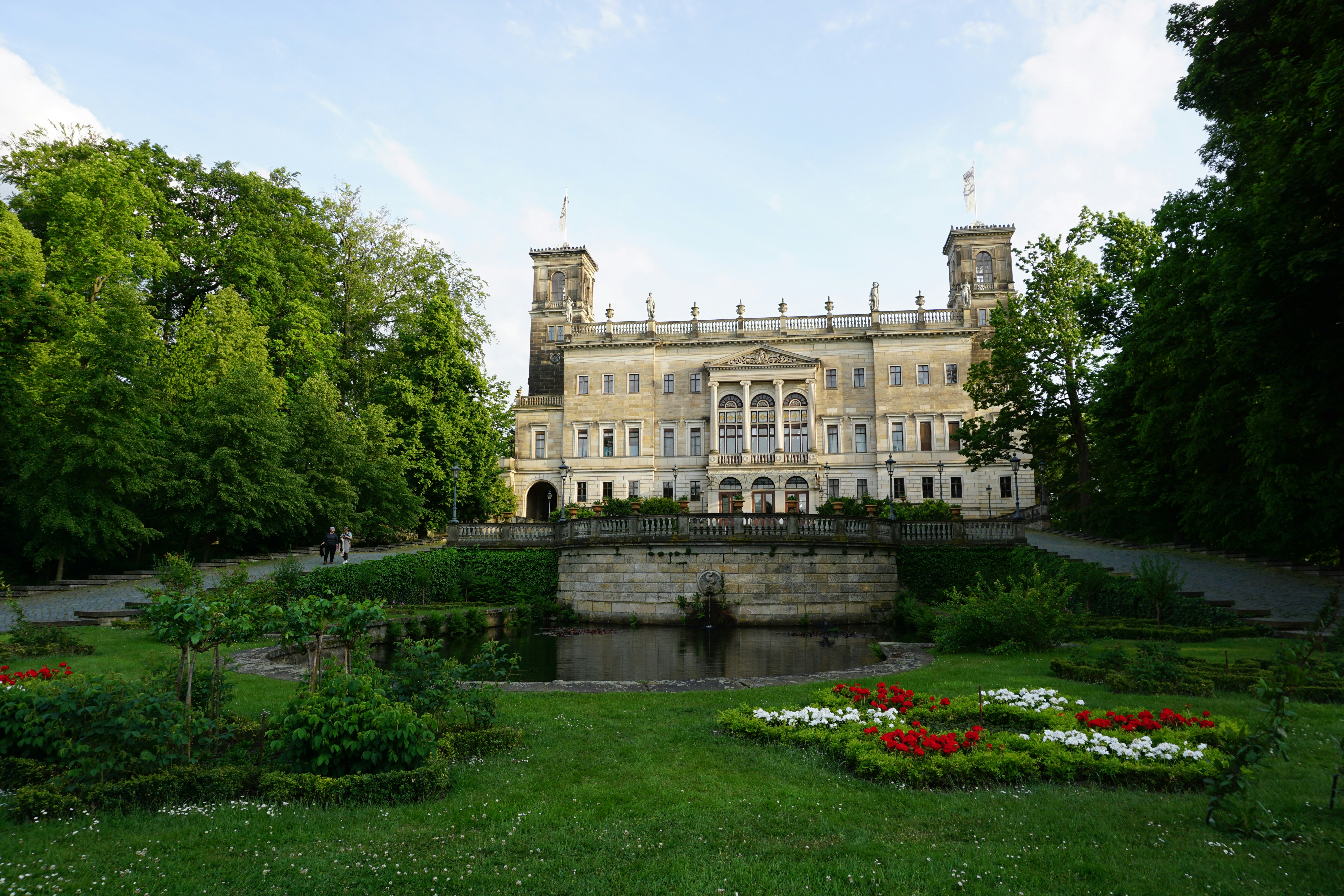 Symmetry in Stone: A Neoclassical Castle Anchored by Verdant Gardens