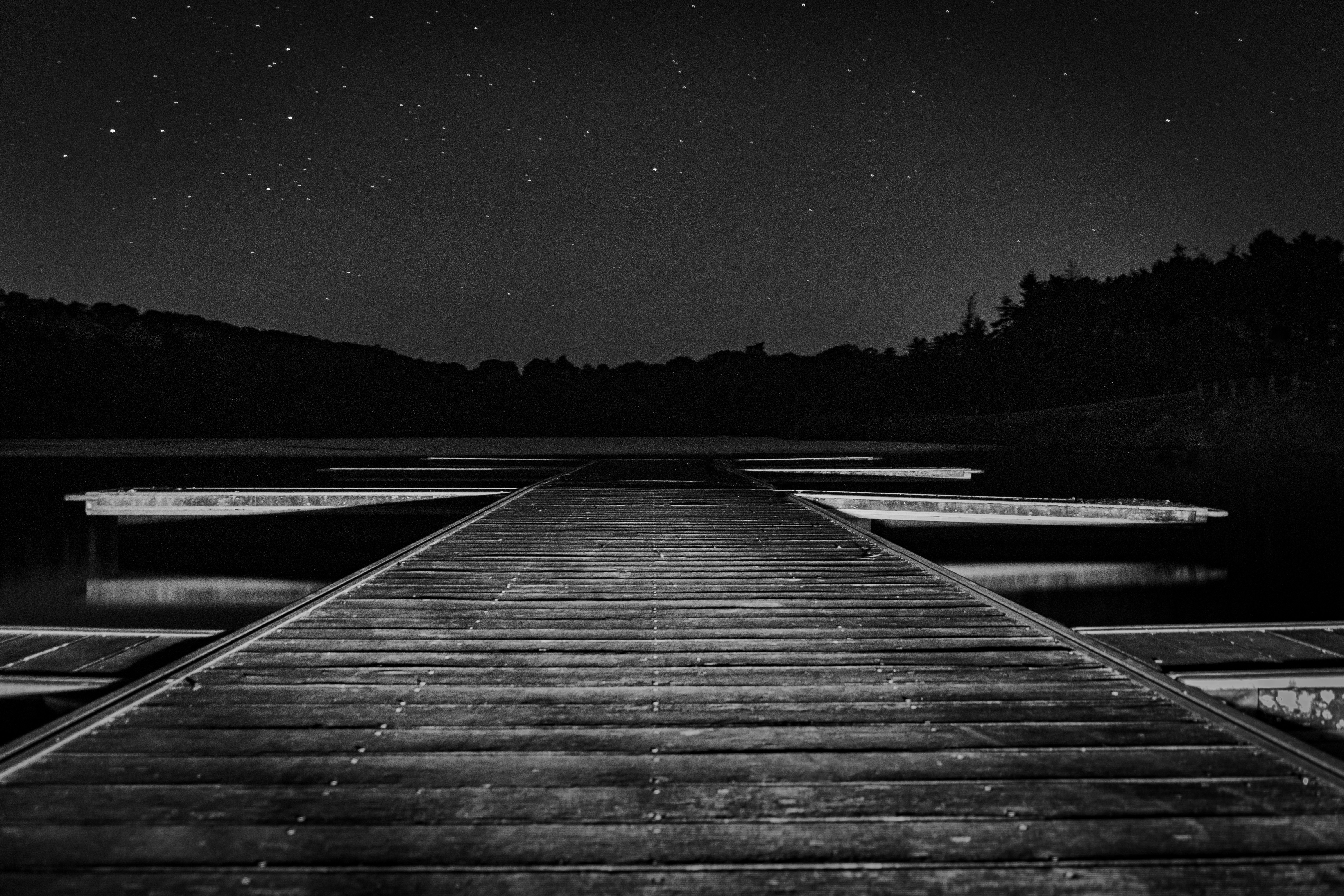 Starbound Pier: A Monochrome Night Walk Toward the Quiet Horizon