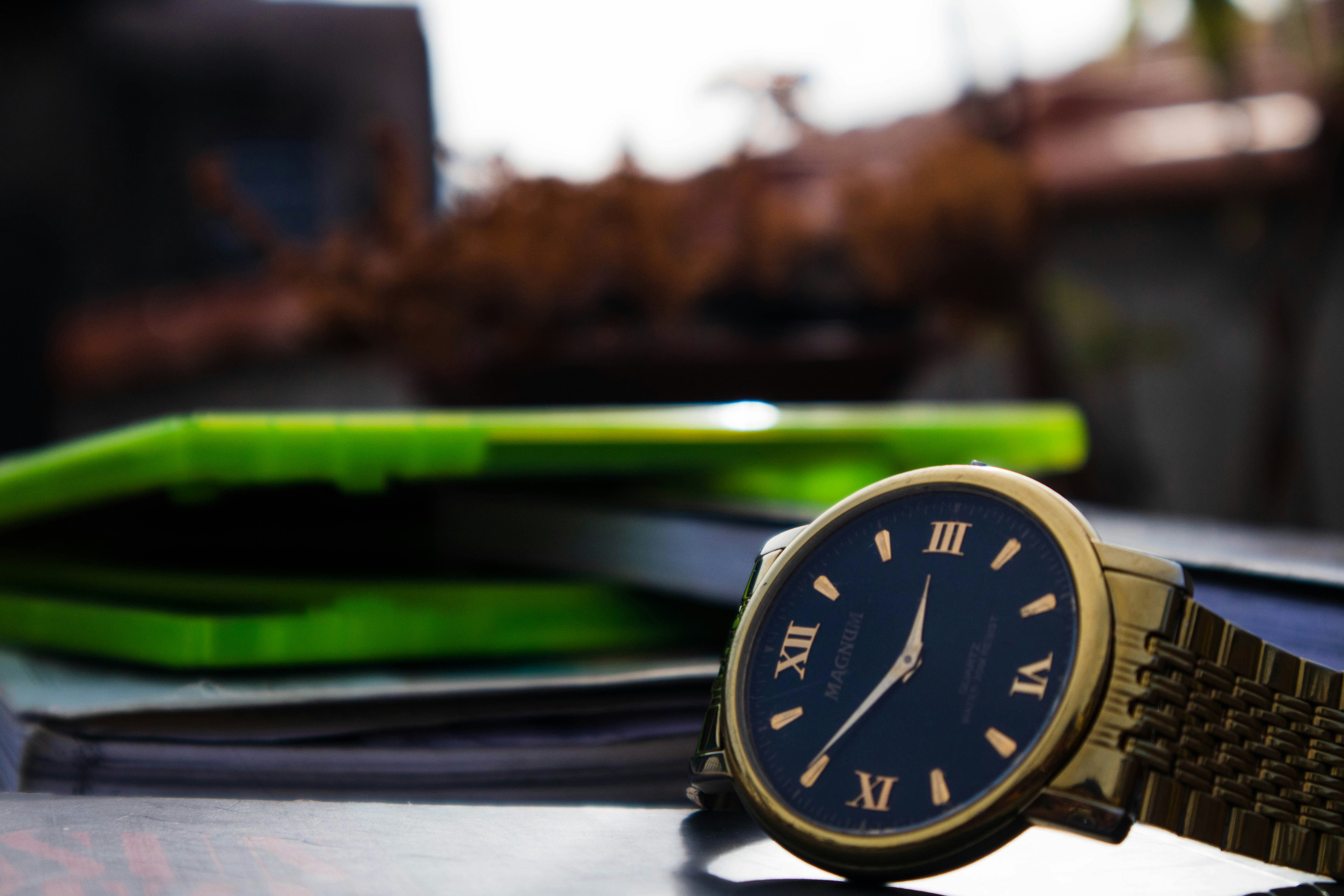 A Quiet Moment with Time: Gold Roman Numerals Resting on a Desk