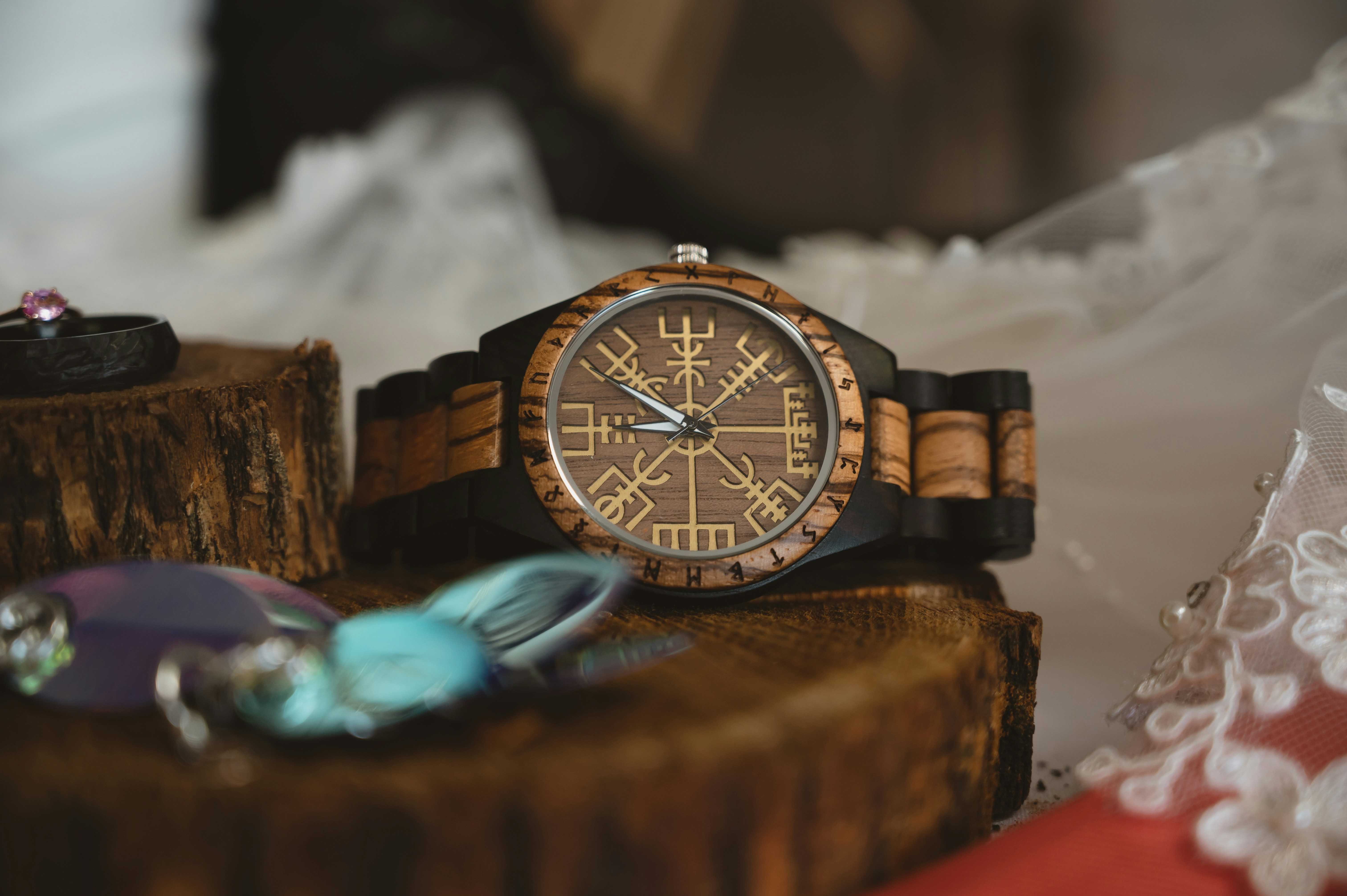 a watch sitting on top of a wooden table