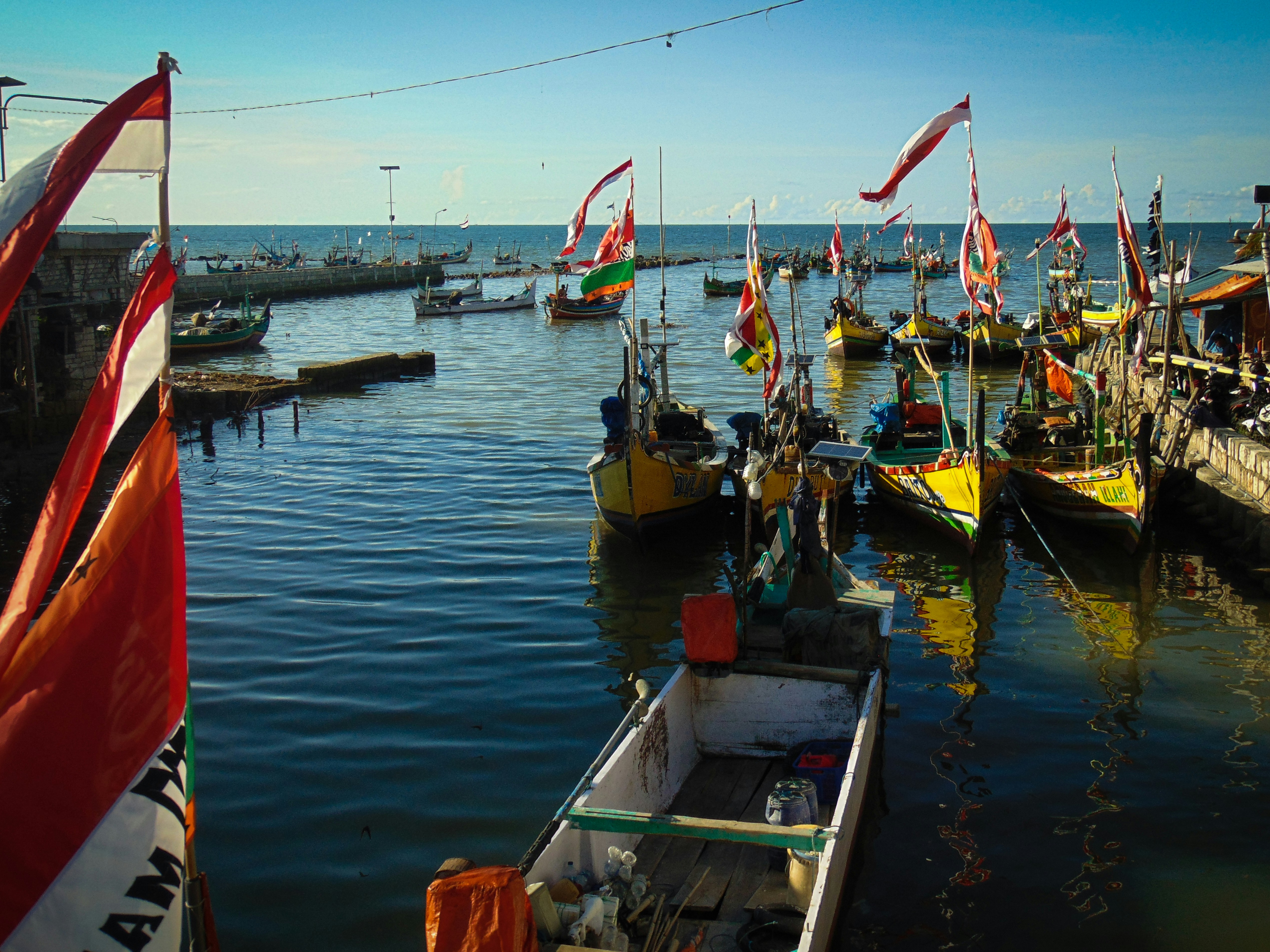 A harbor filled with lots of small boats photo – Free East java Image ...