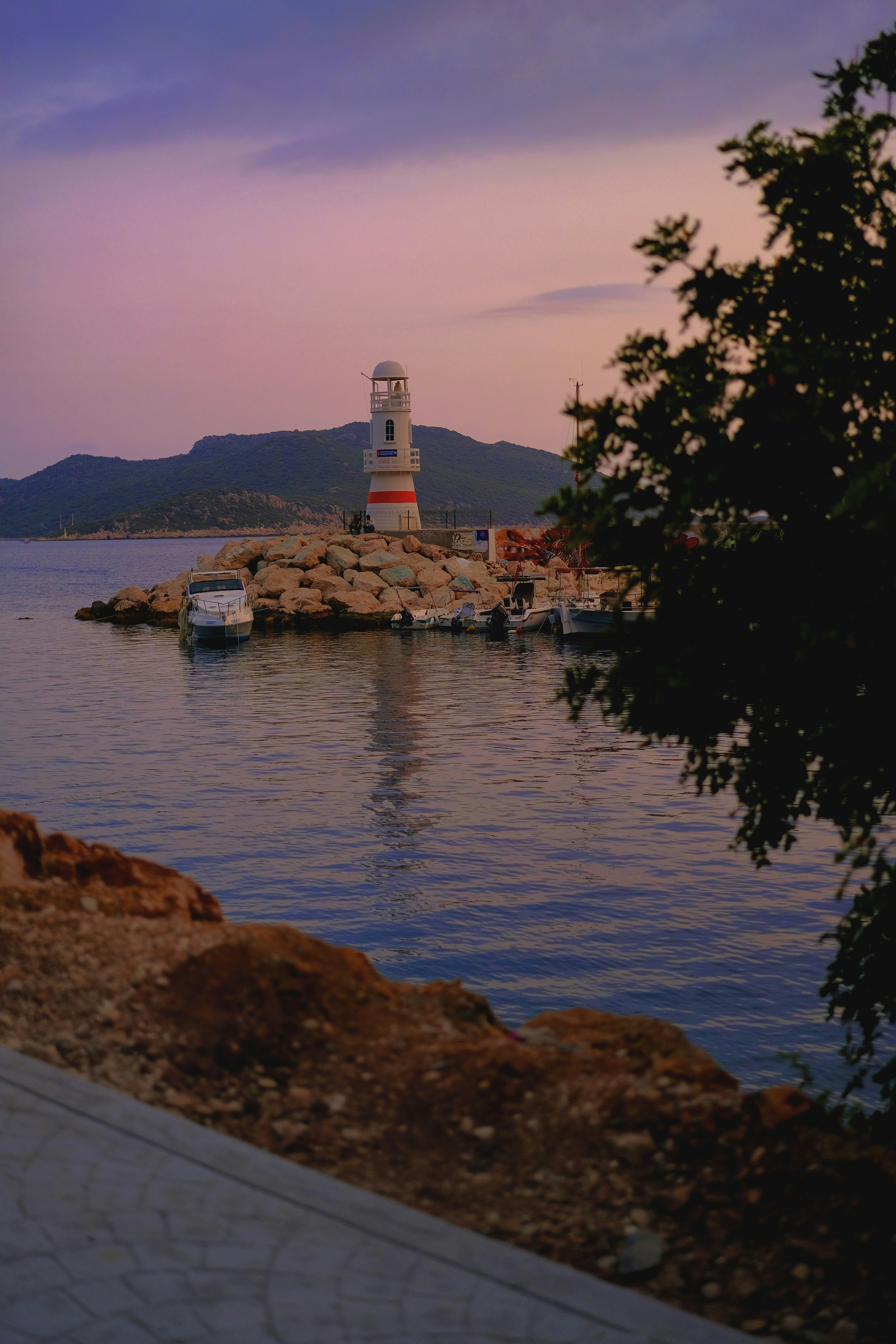 Twilight Lighthouse Guarding a Quiet Cove