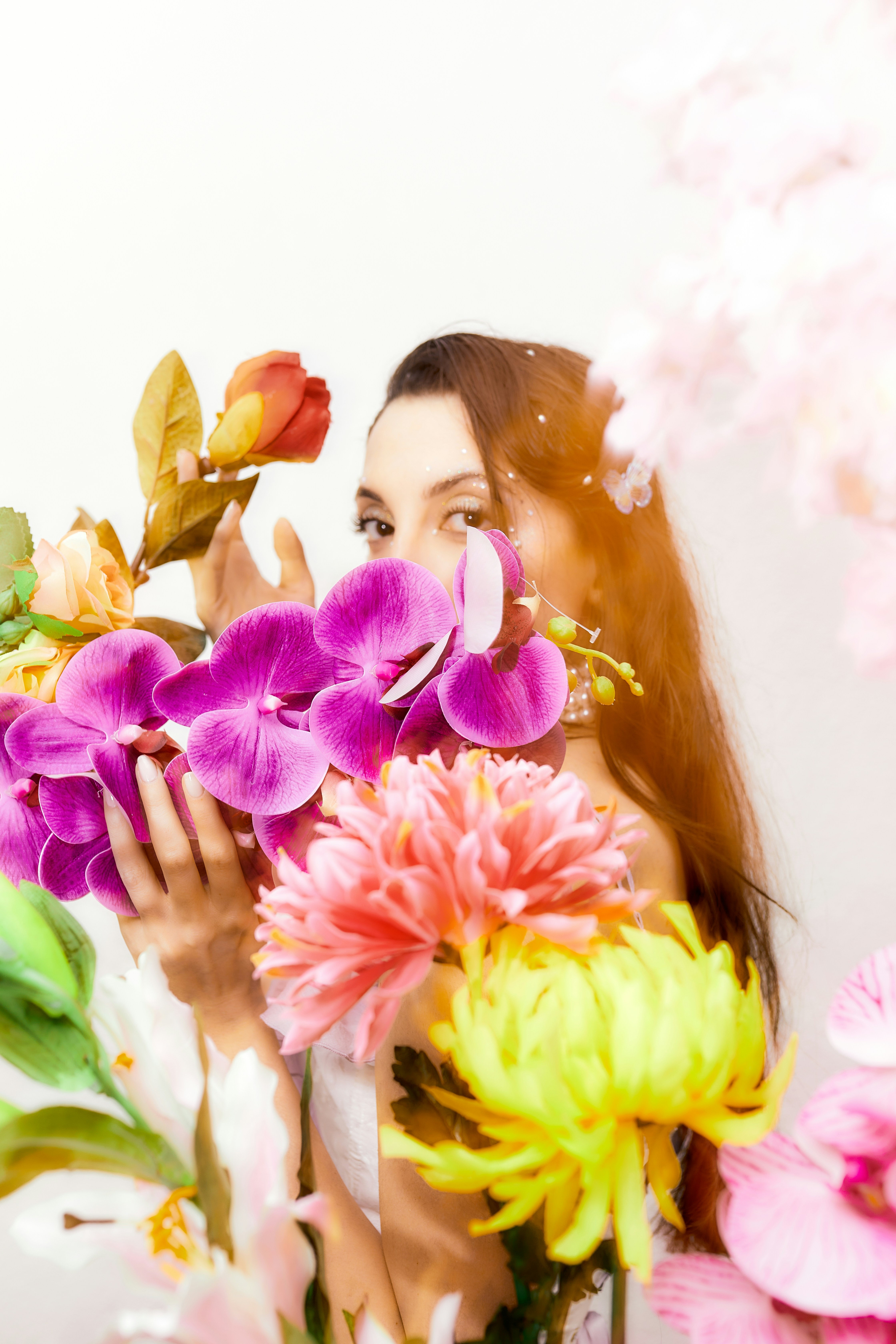 Orchid Veil: A Portrait Through a Burst of Blooms