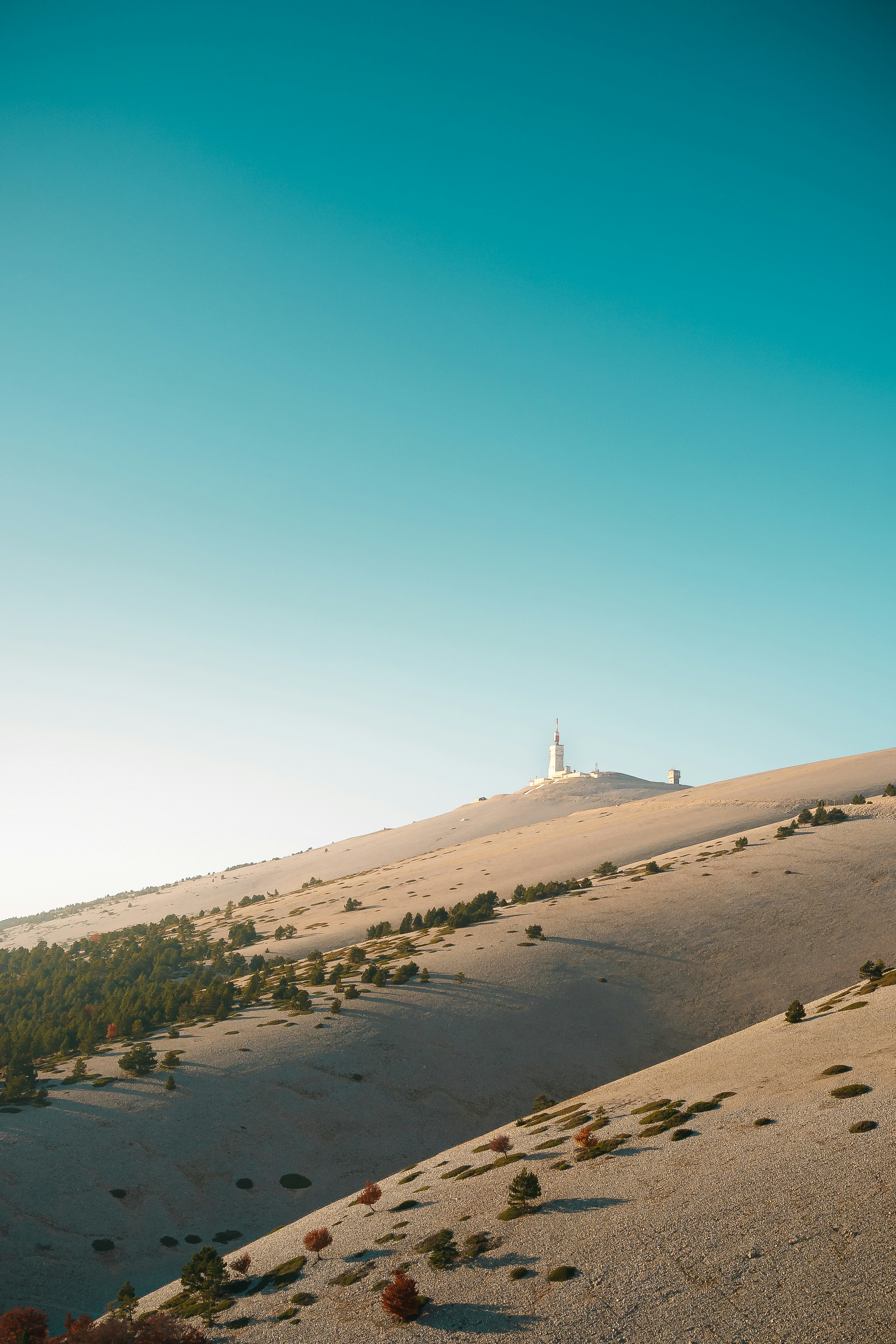 A white lighthouse on top of a hill in the desert photo – Free Provence ...