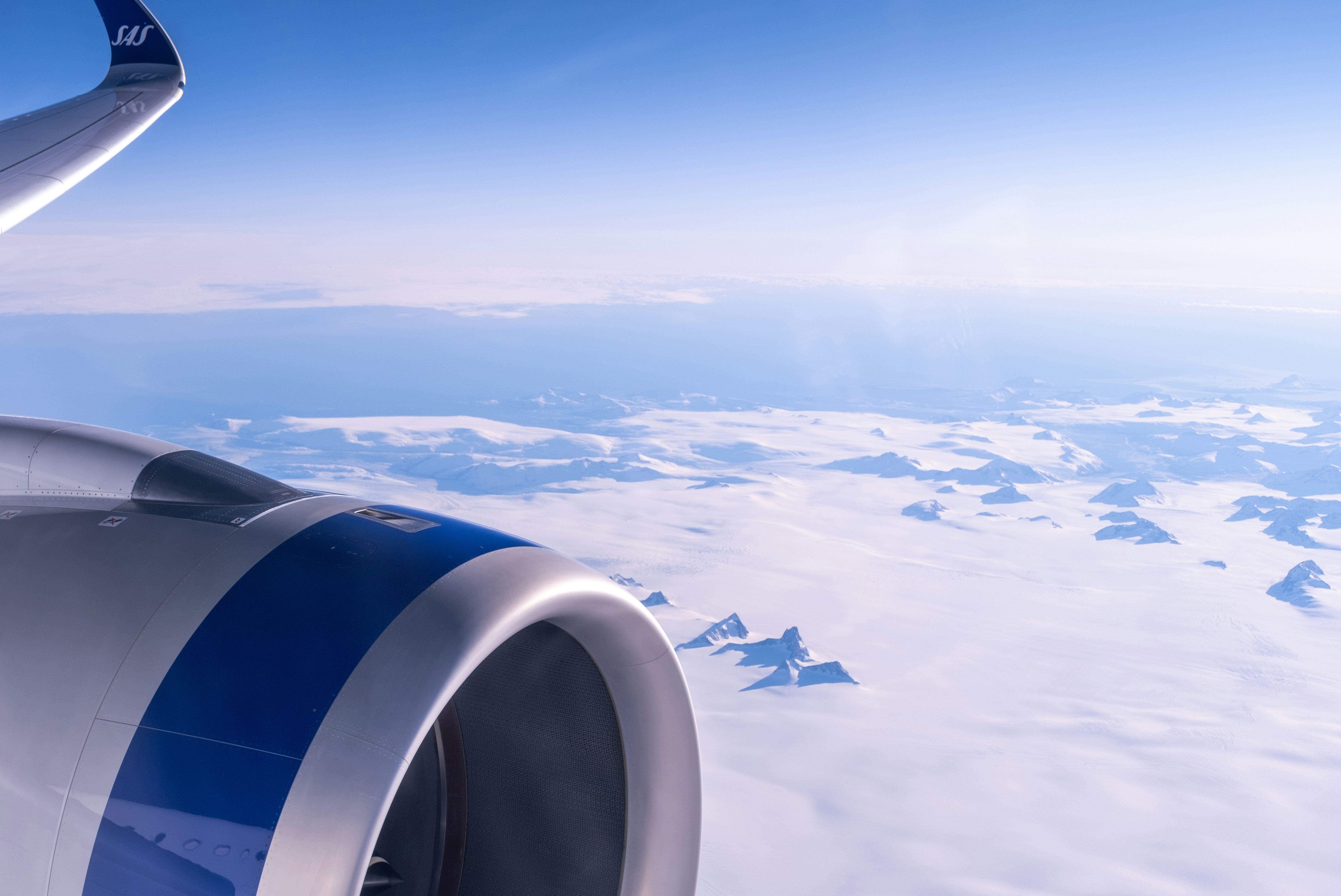 Blue Stripes at the Edge of Clouds: An In-Flight Portrait