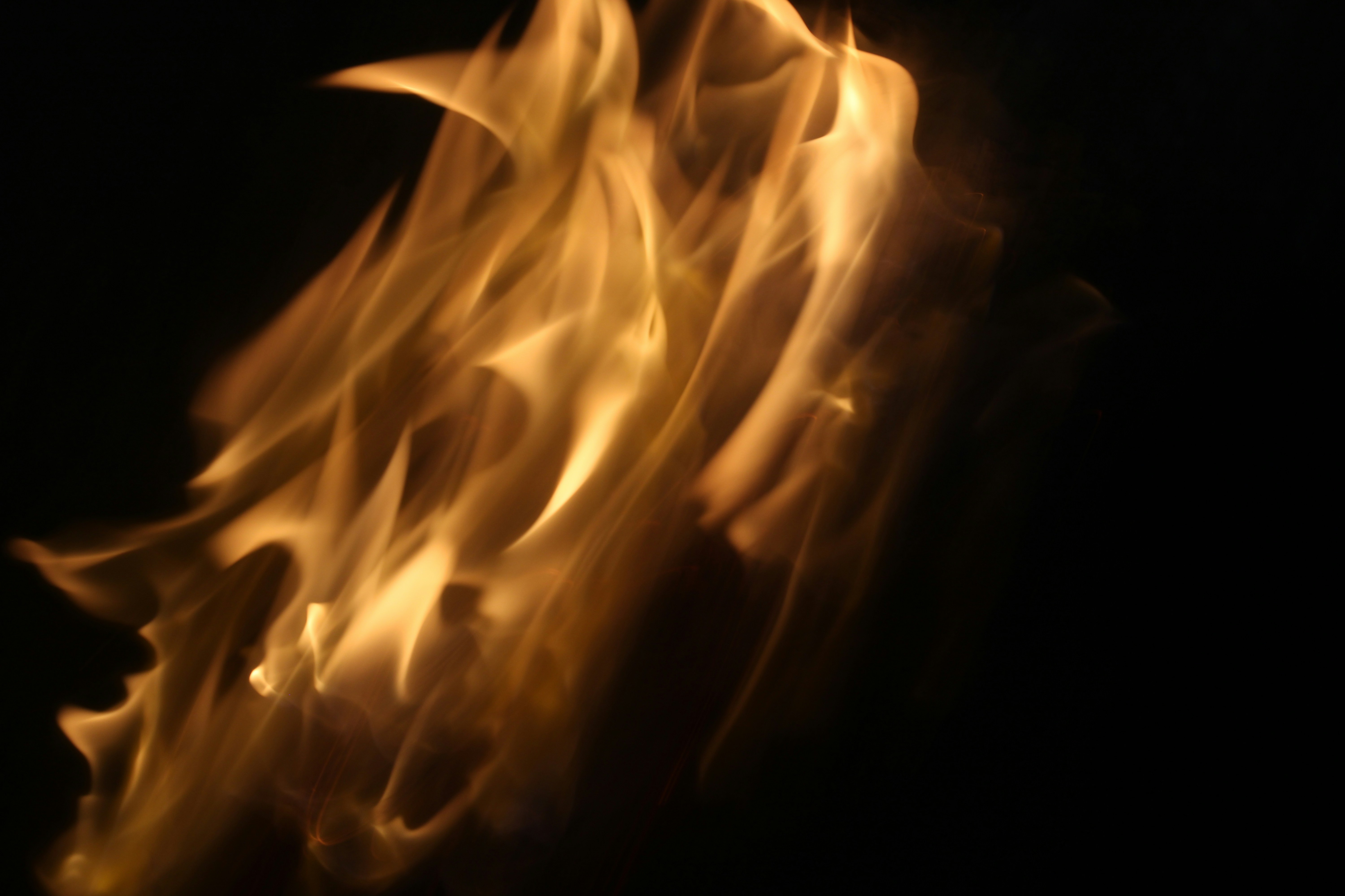 A close up of a fire on a black background photo – Free Fire Image on ...