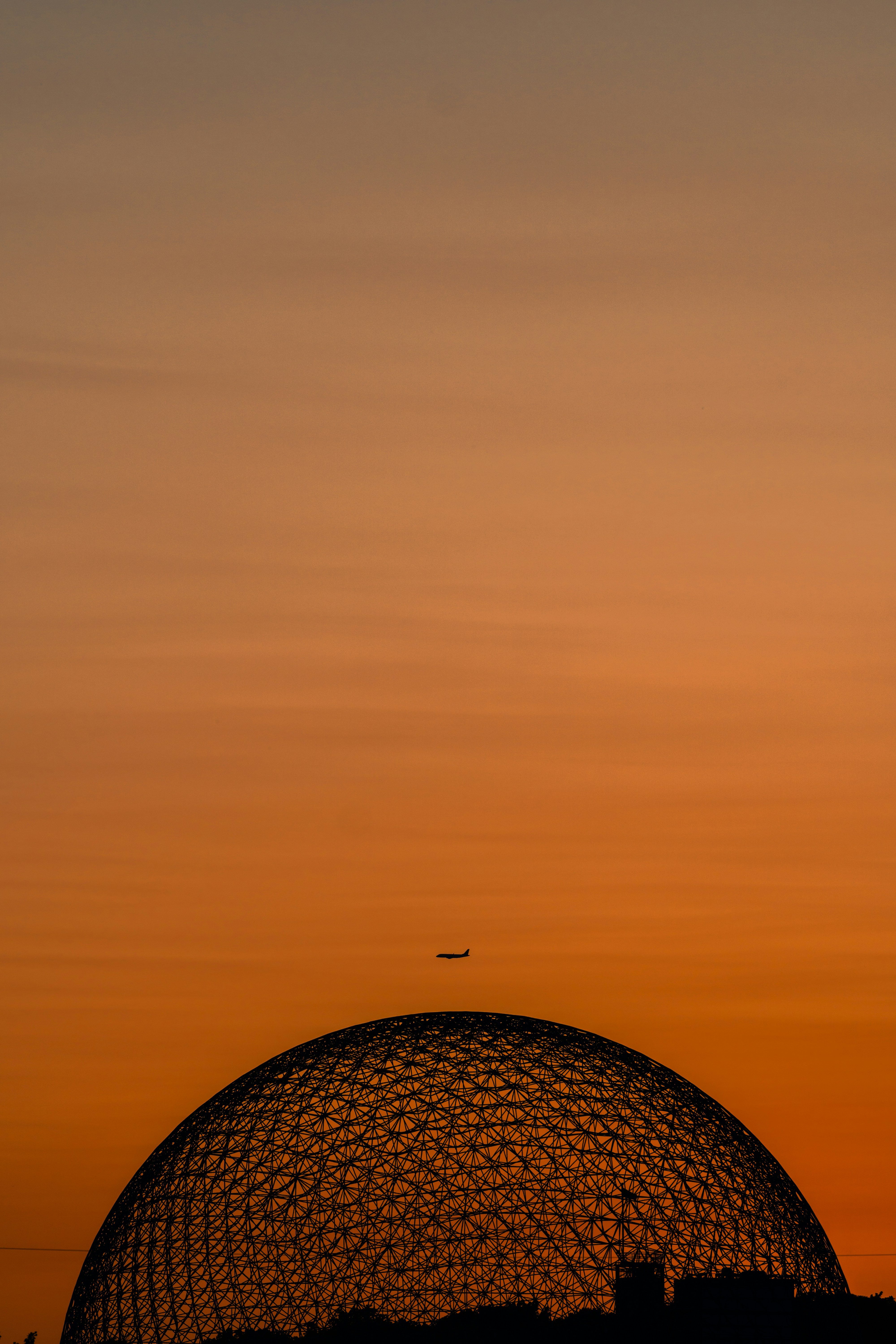 A plane flying in the sky over a dome photo – Free Montreal Image on ...