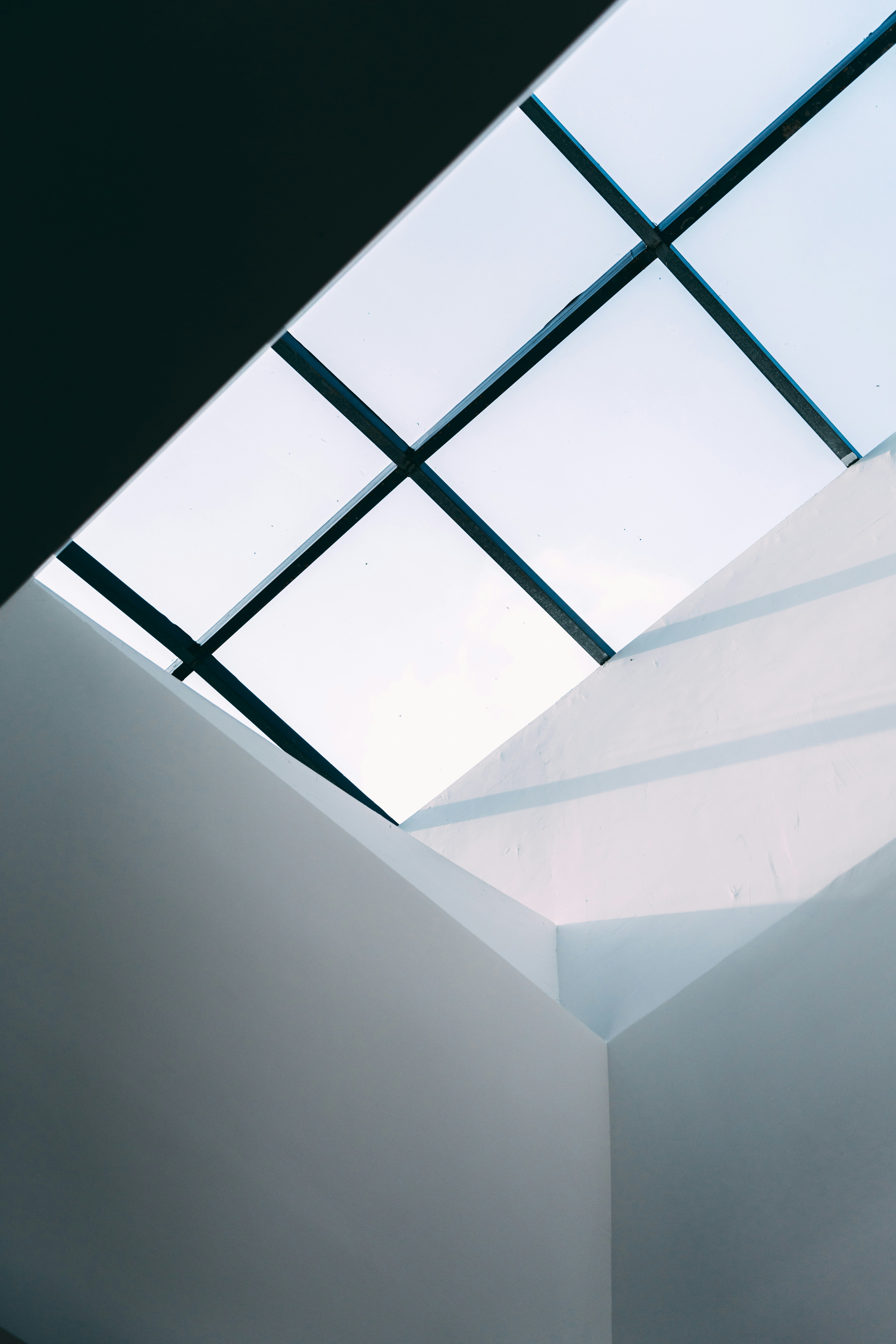 A white room with a skylight above it photo – Free Ceiling Image on ...