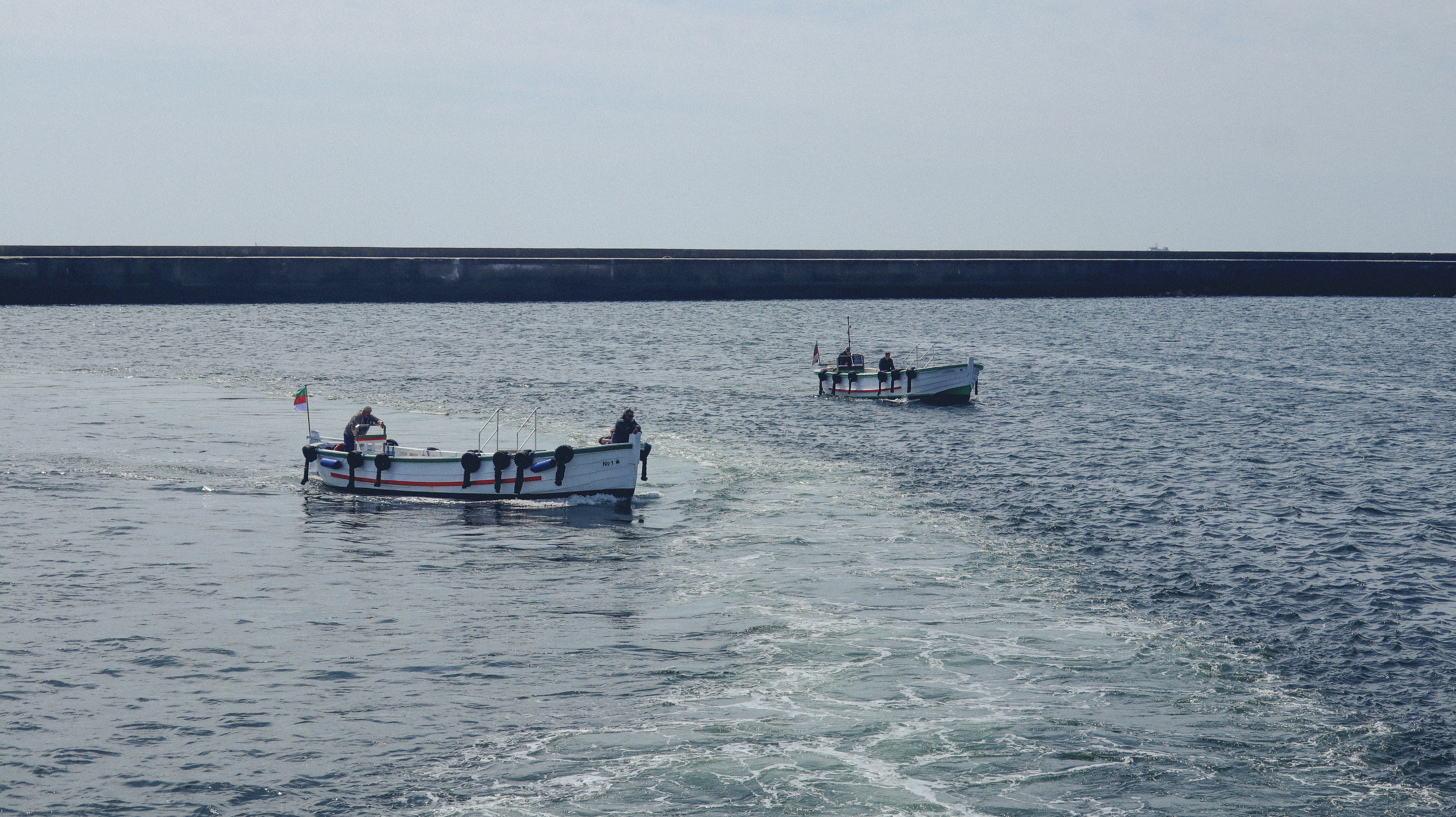 a couple of boats that are in the water
