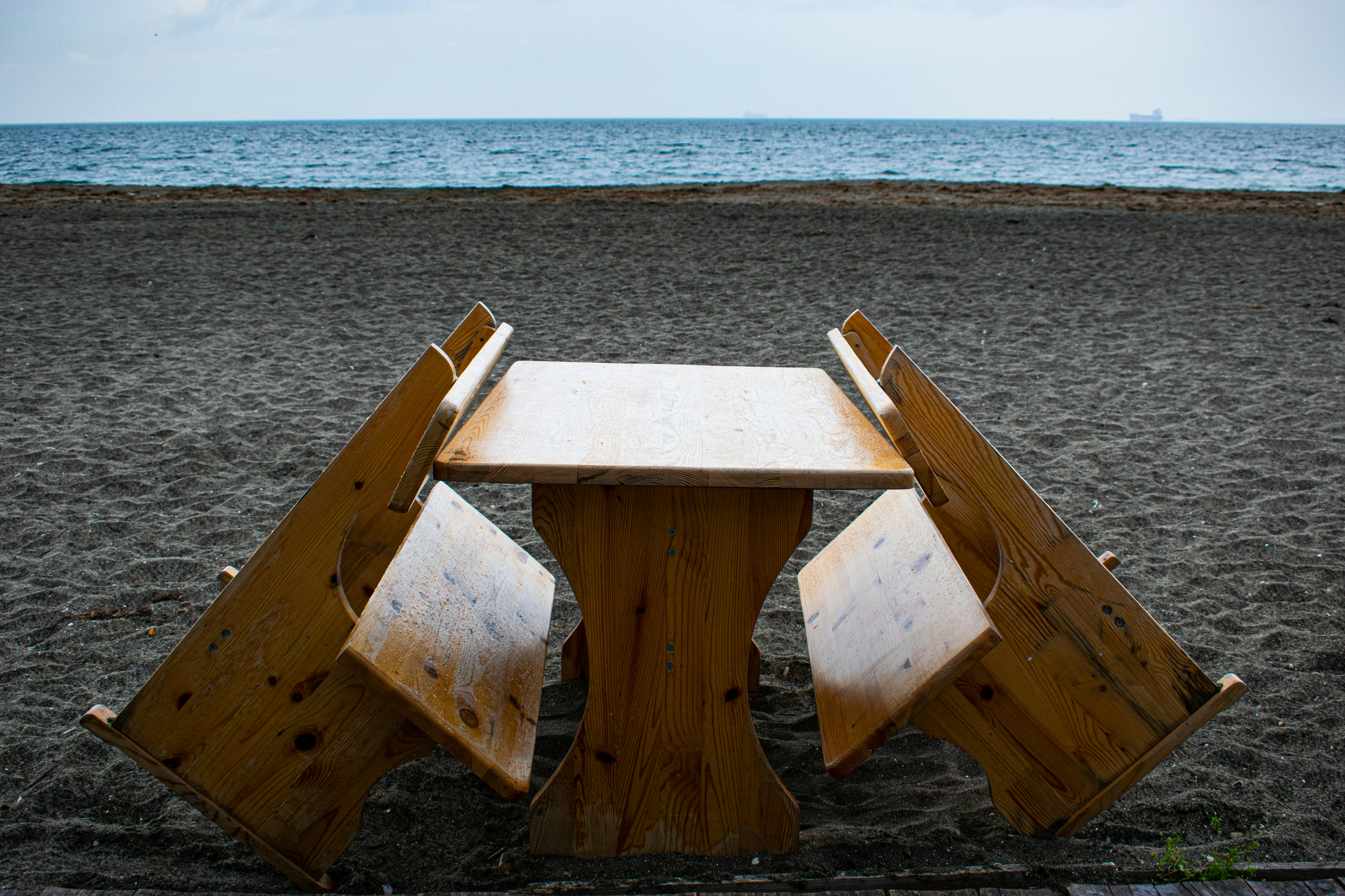 Symmetrical Beach Table Ensemble Framed by the Sea
