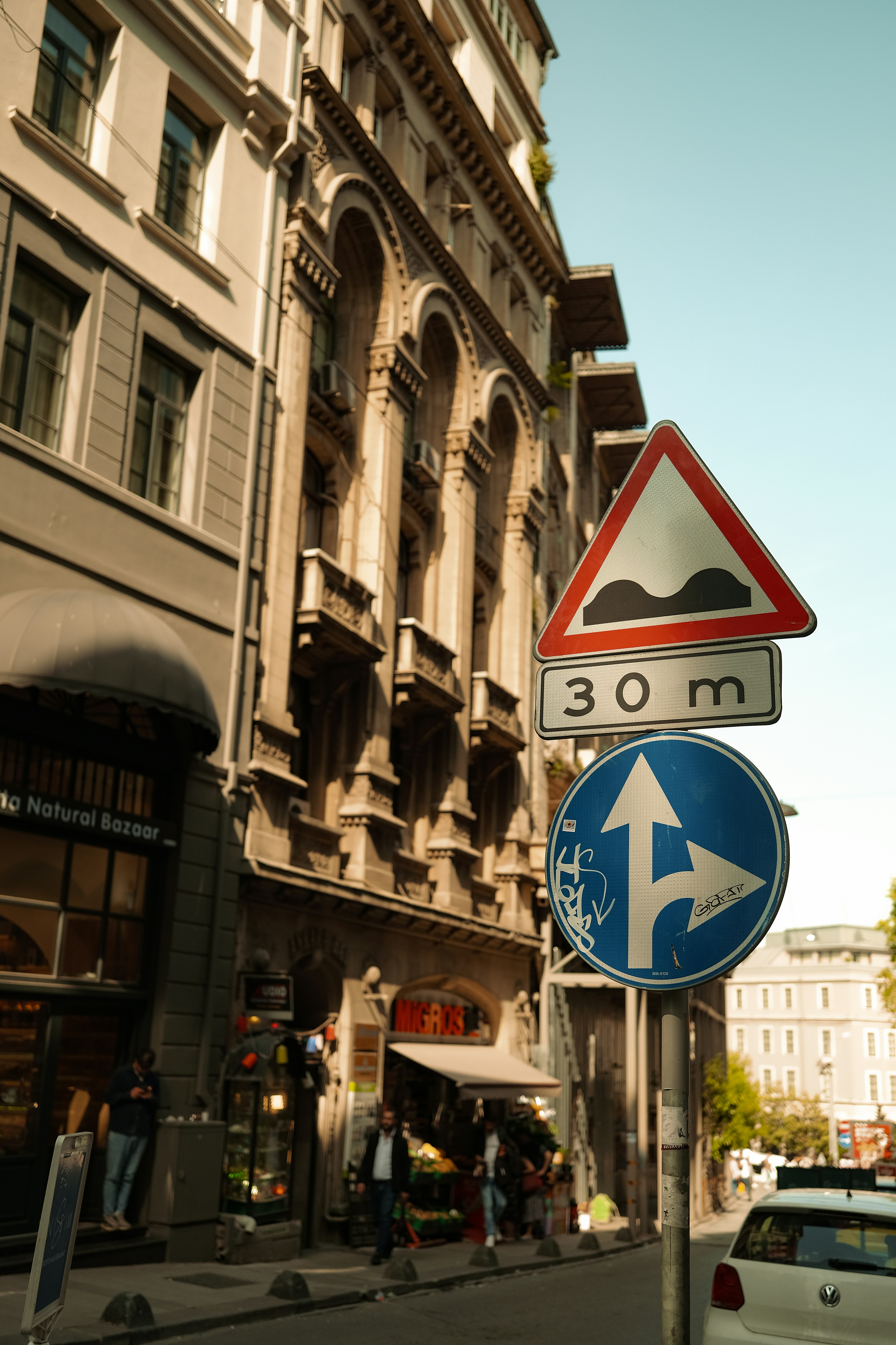 Urban Signpost Serenade: A City Street under Narrow Sky
