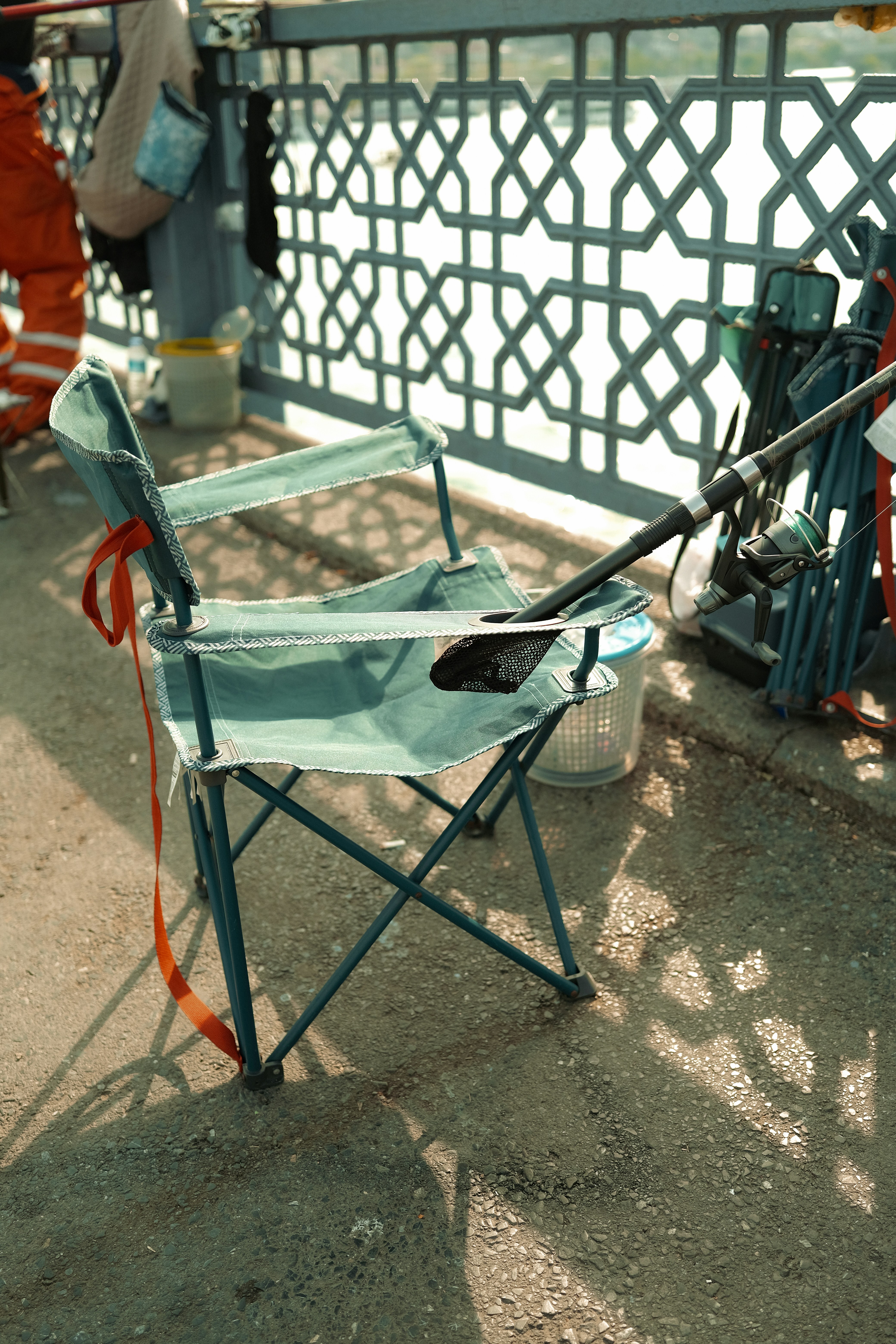 Blue Folding Chair on a Sunlit Ferry Deck
