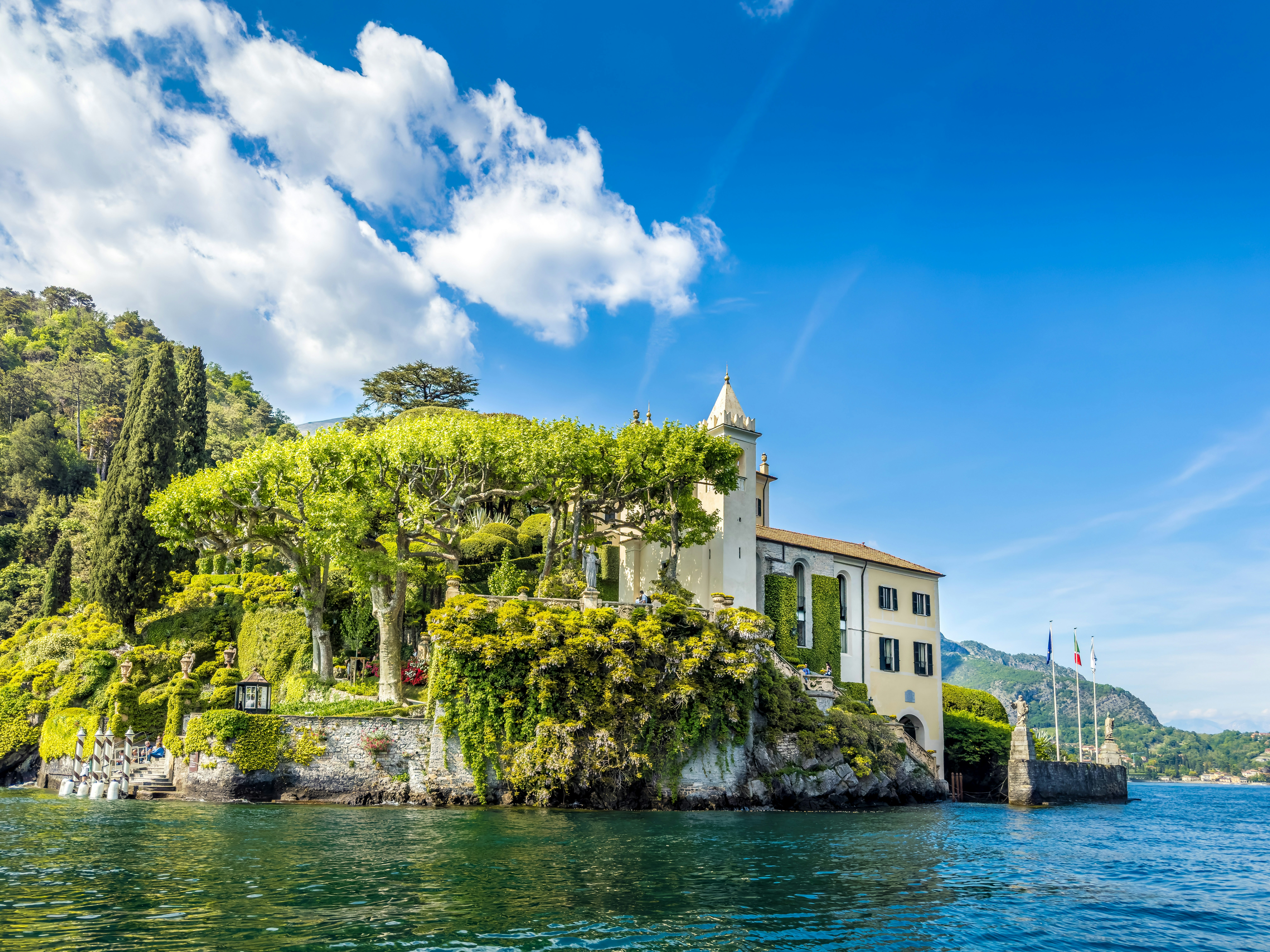 A house on a small island in the middle of the water photo – Free Italy ...