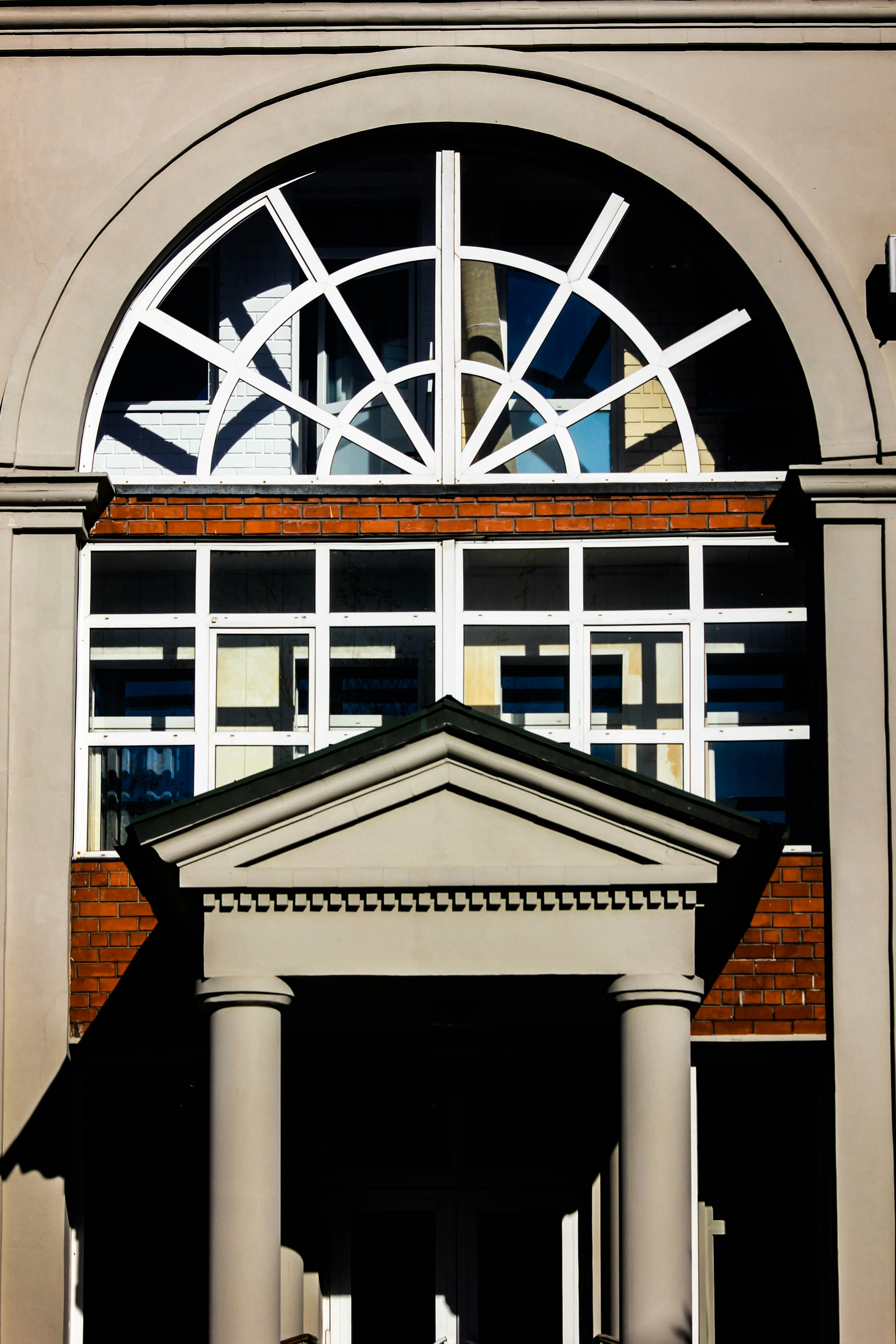 Sunburst Window Over a Classical Portico