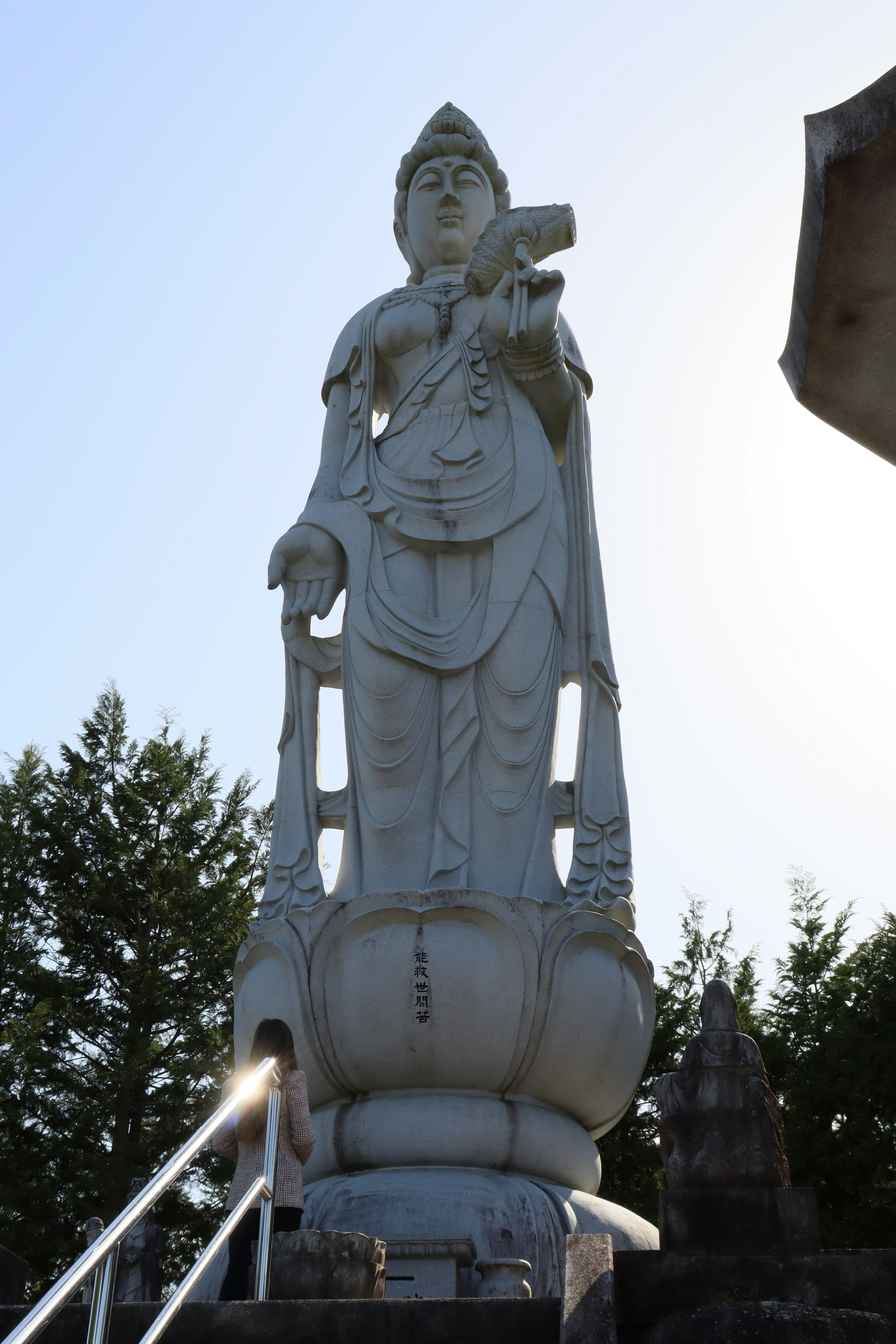 Dawn Sentinel: Standing Bodhisattva Above a Stone Pedestal