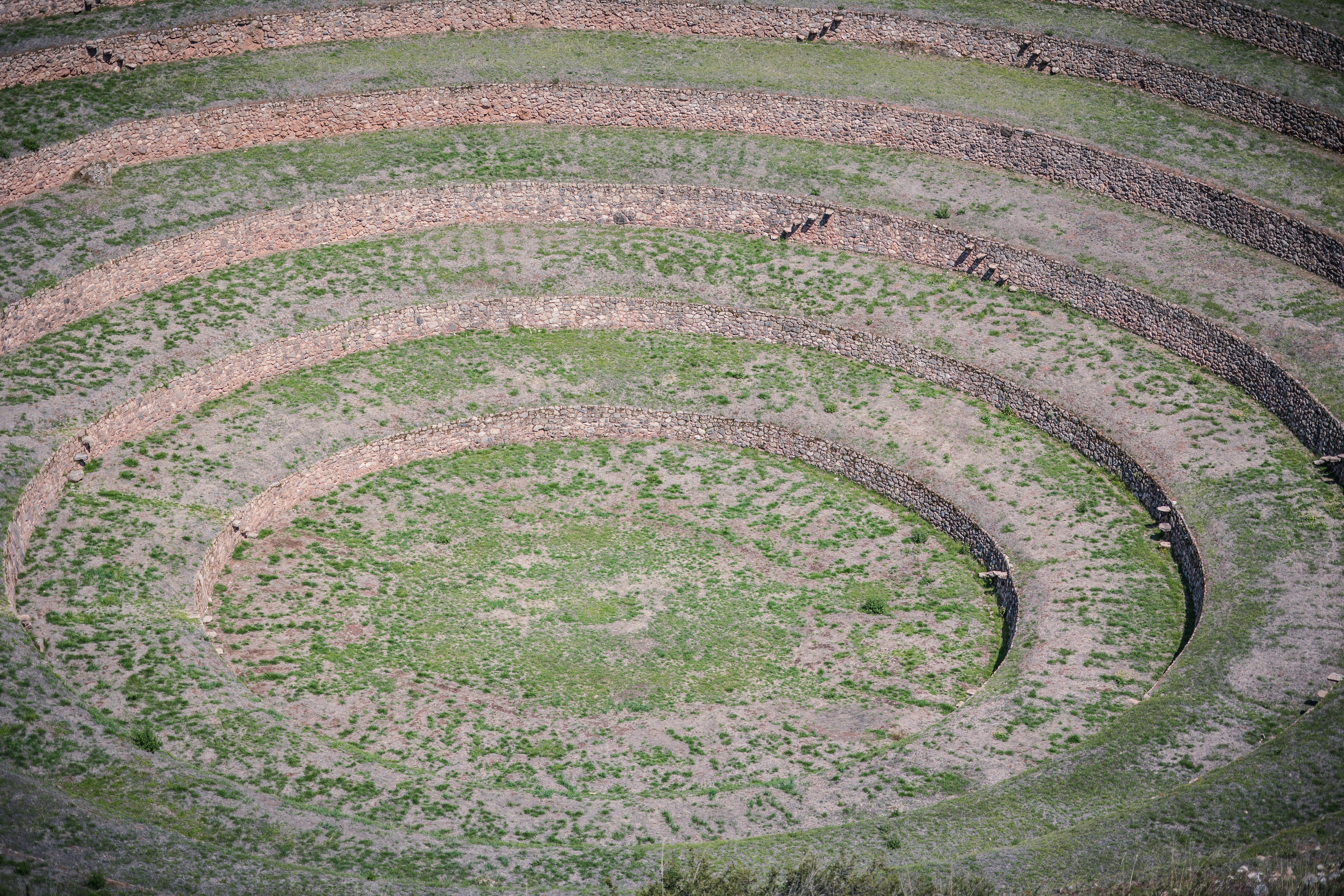 An aerial view of a circular stone structure photo – Free Land Image on ...