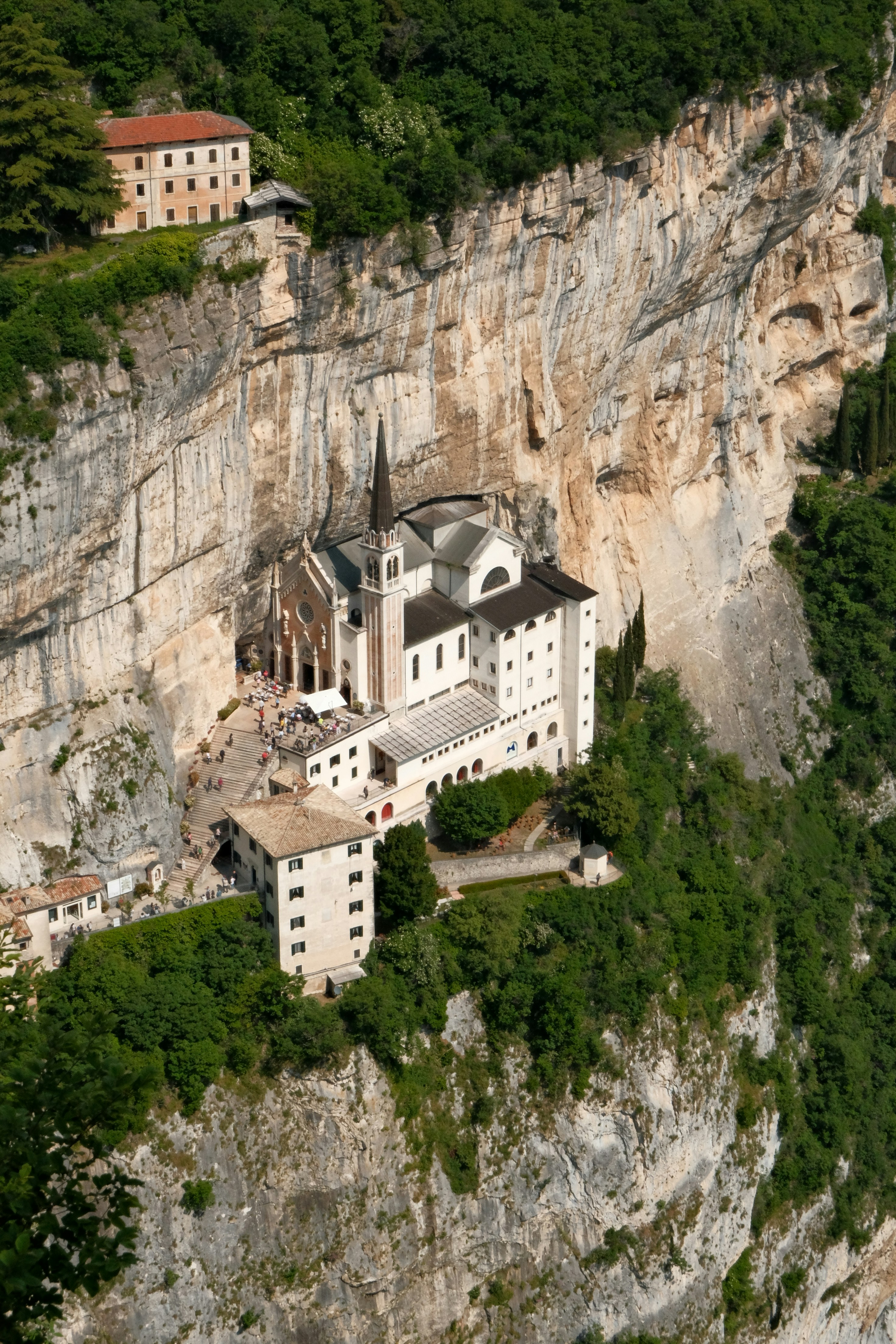 A large white building sitting on top of a cliff photo – Free Vr Image ...