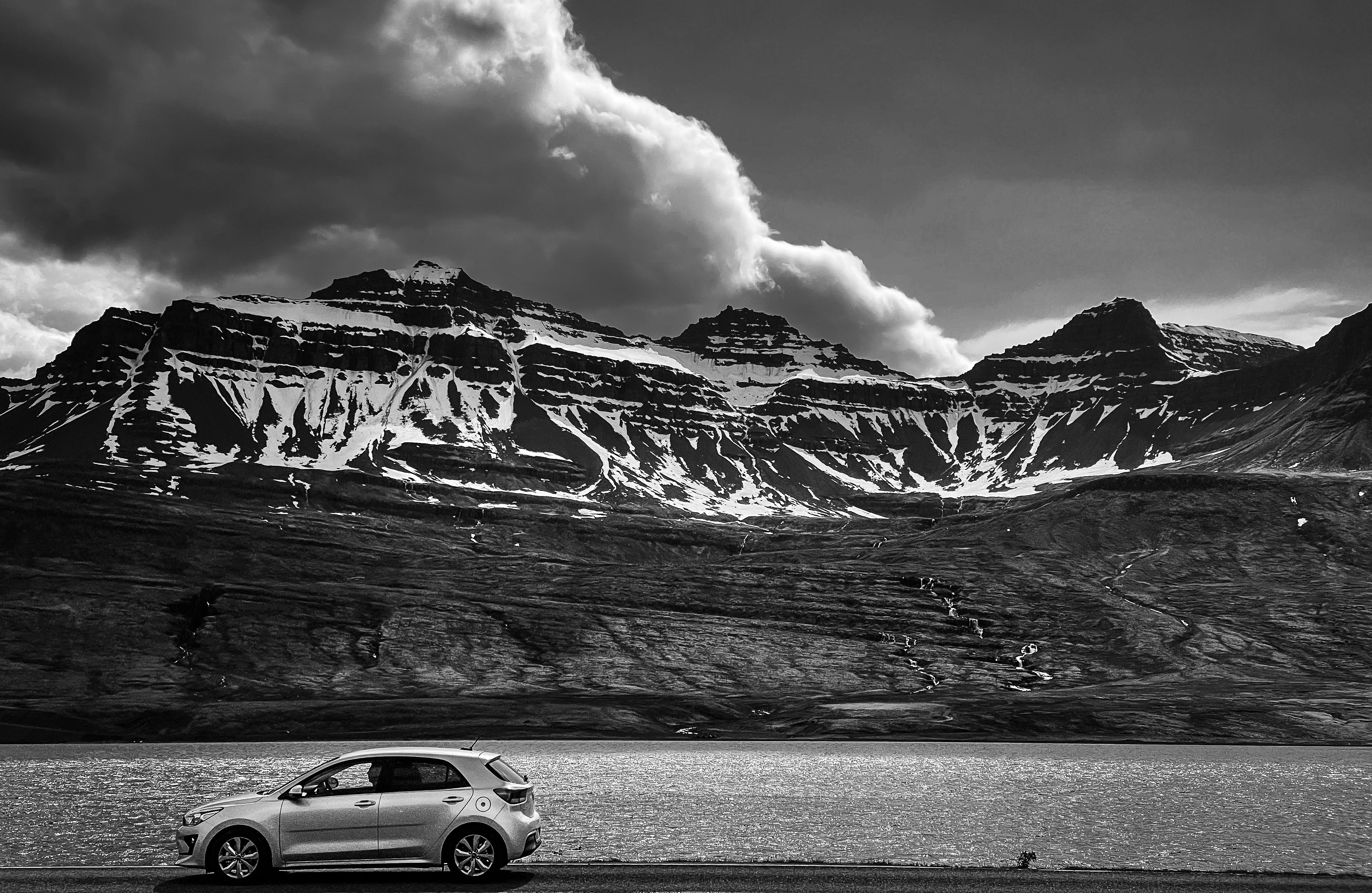 Quiet Car at the Edge of a Snow-Capped Panorama