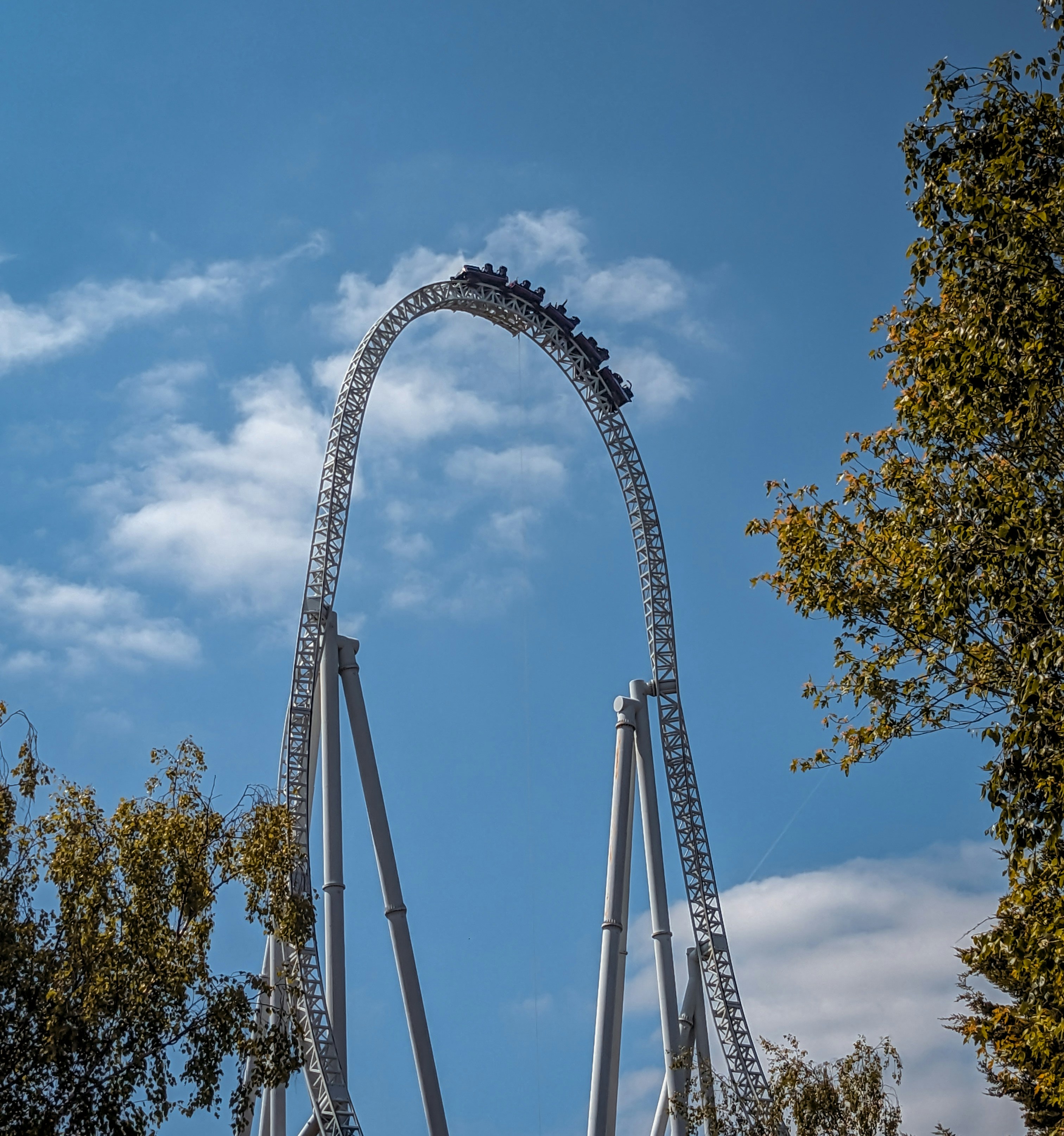 A roller coaster going through the air on a sunny day photo – Free ...