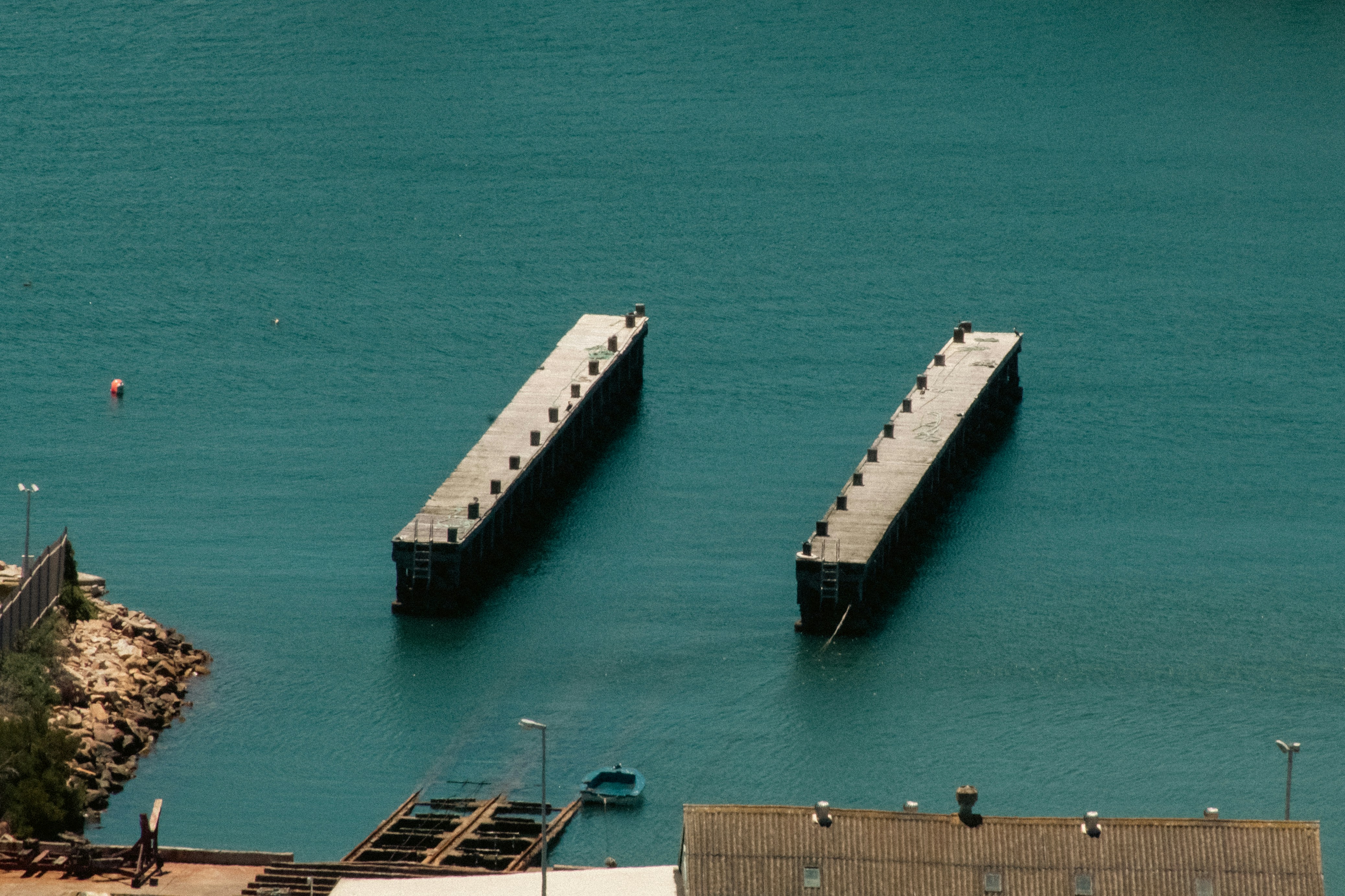 A couple of large boats floating on top of a body of water photo – Free ...
