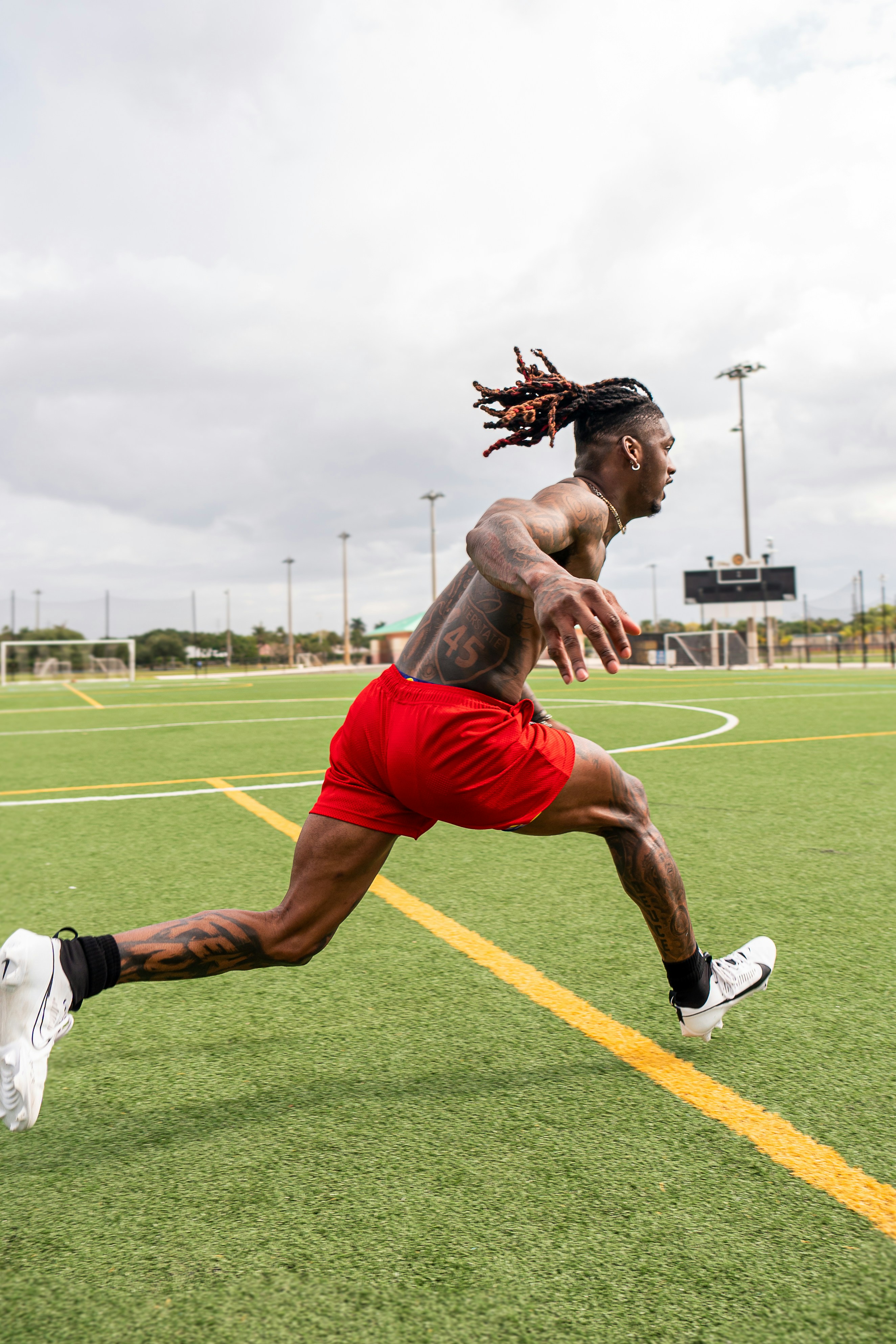 A man running across a field with a frisbee photo – Free Man Image on ...