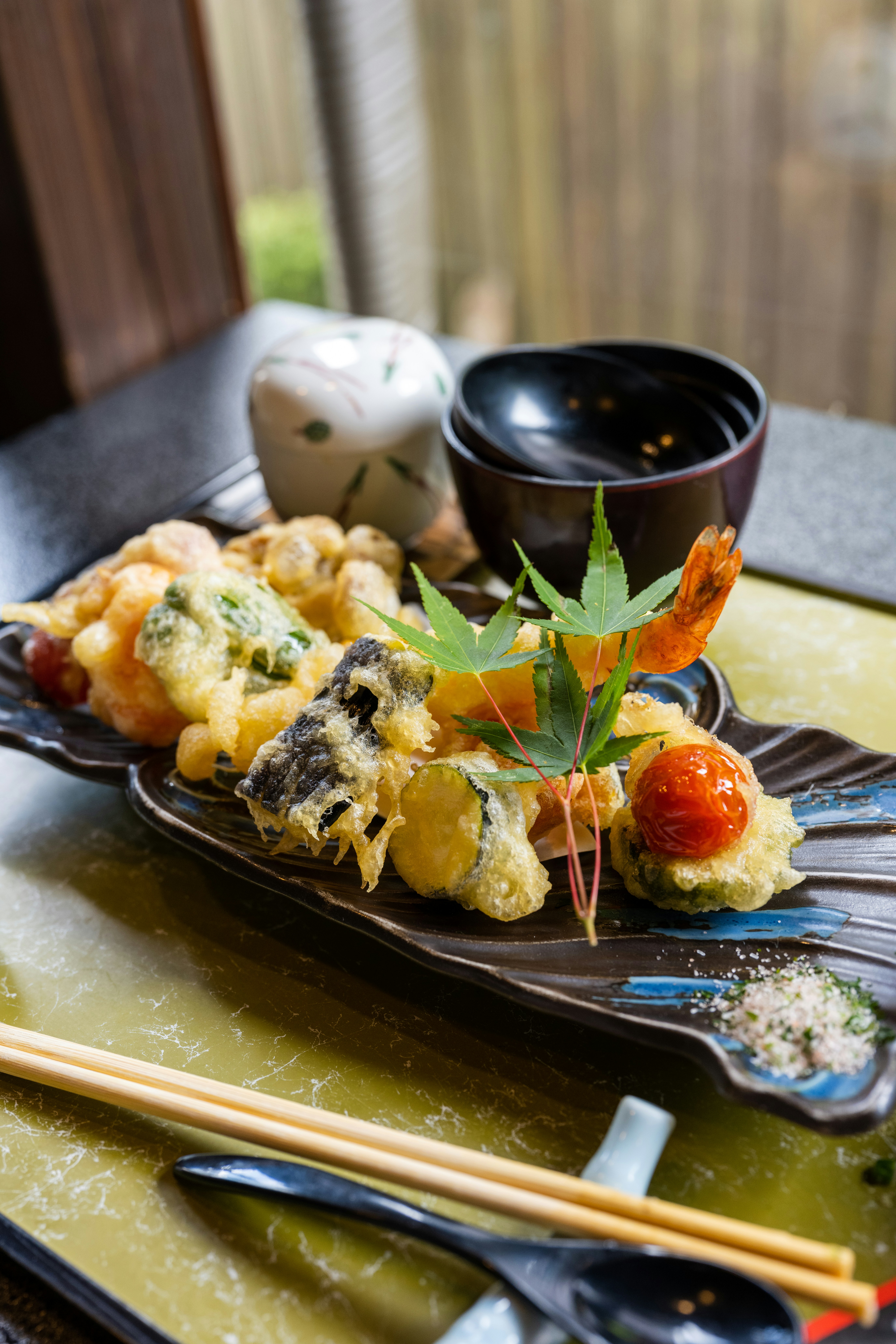 Leafy Garnish and Tempura Symphony on a Ceramic Platter
